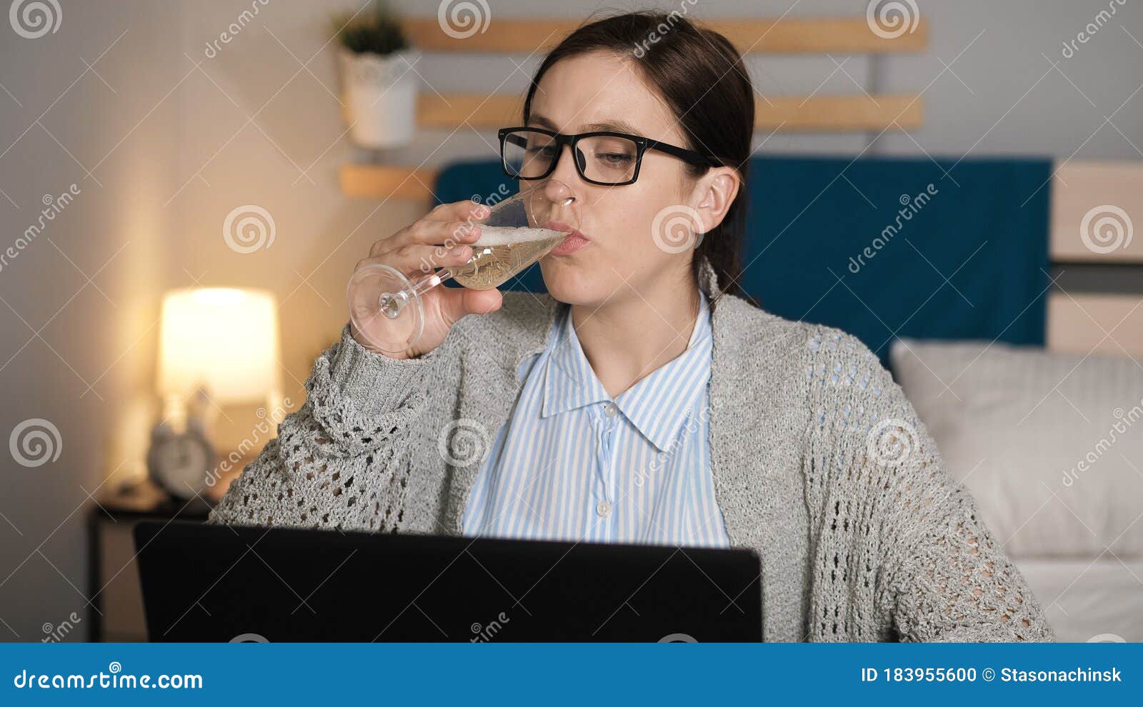 Girl Drinks Wine And Works At Computer Woman With Glasses Alone In