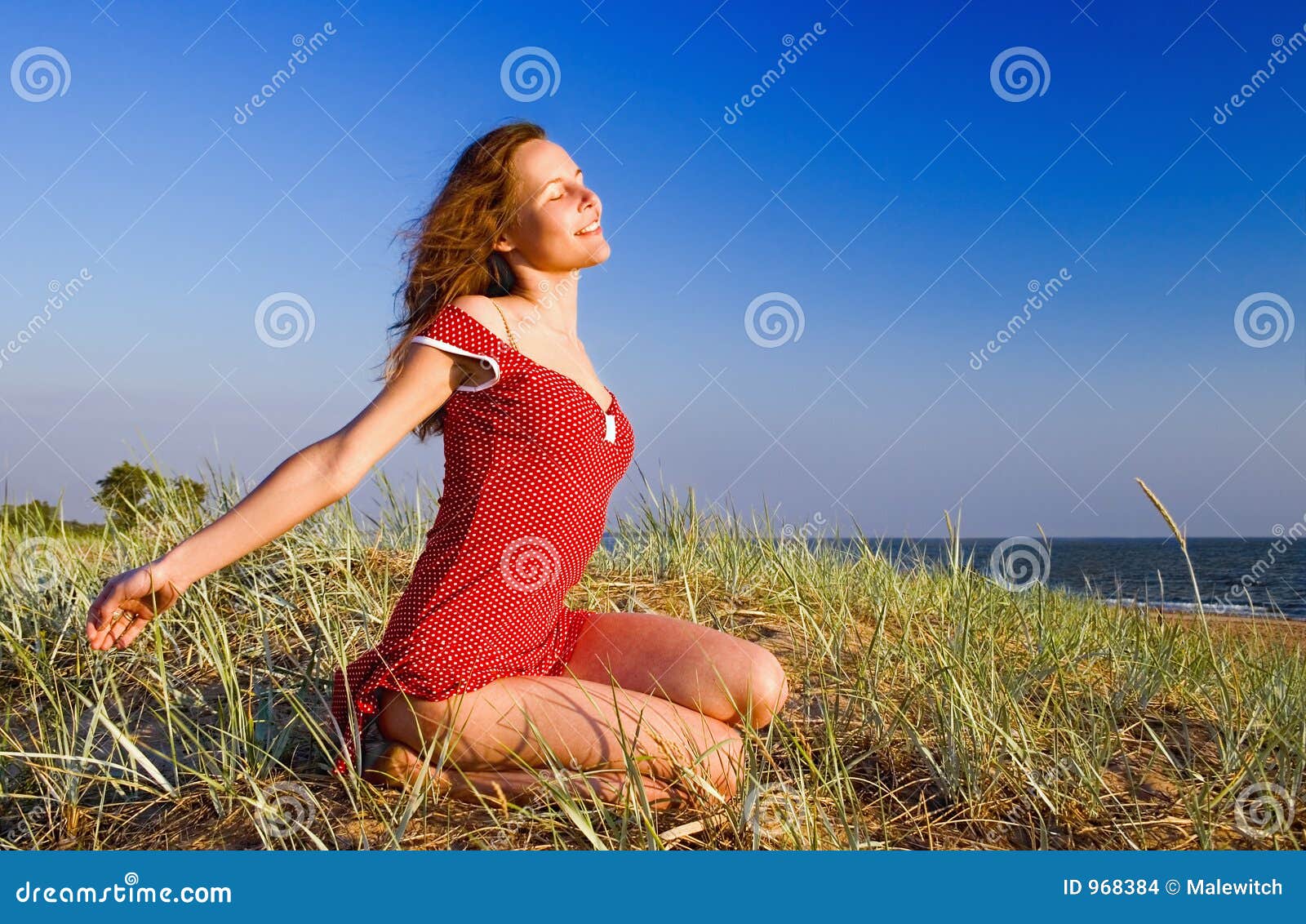Girl on a dune-2 stock photo. Image of hair, grass, look - 968384