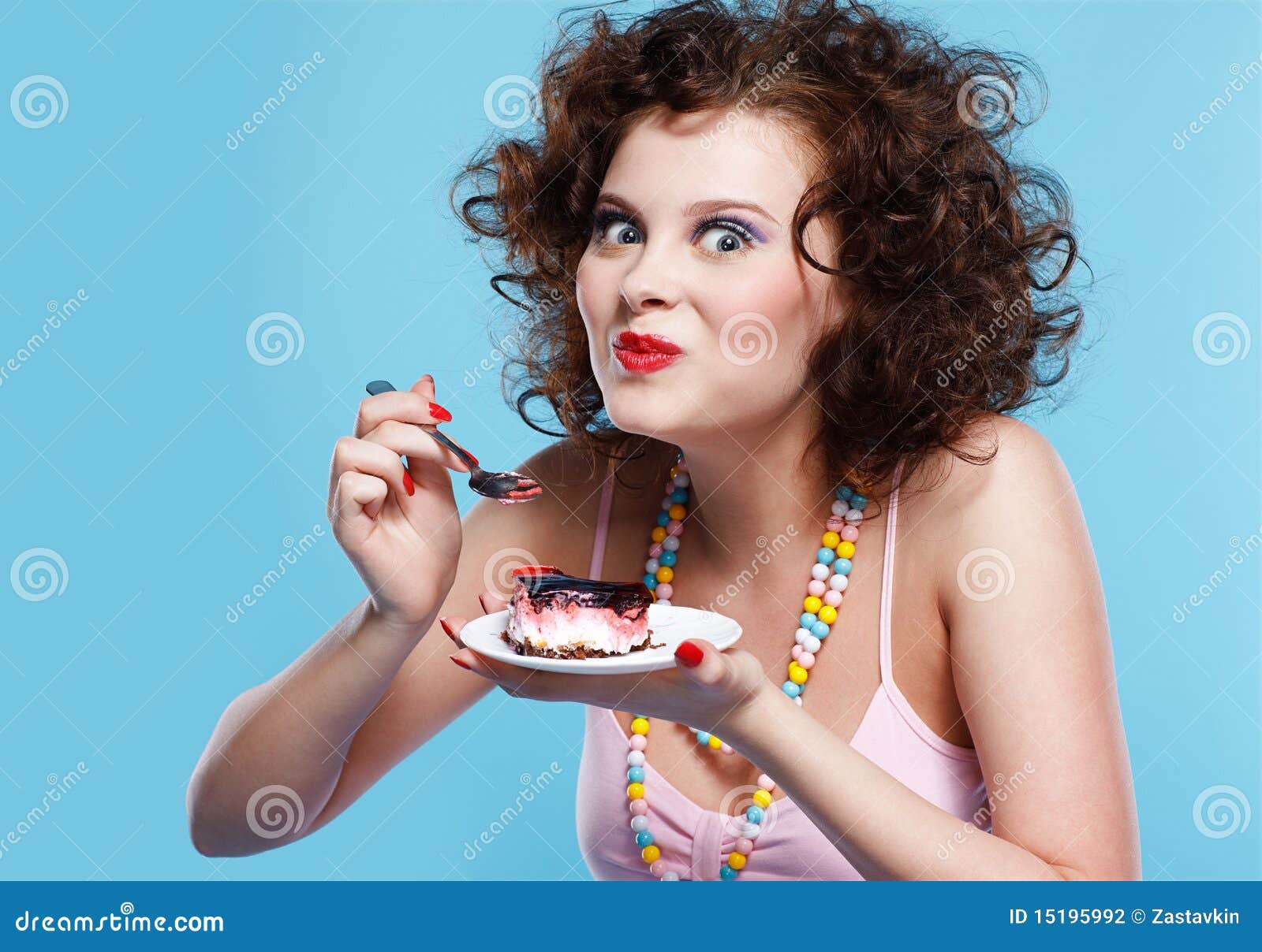 Girl eating cake stock photo. Image of face, blue, curly - 15195992