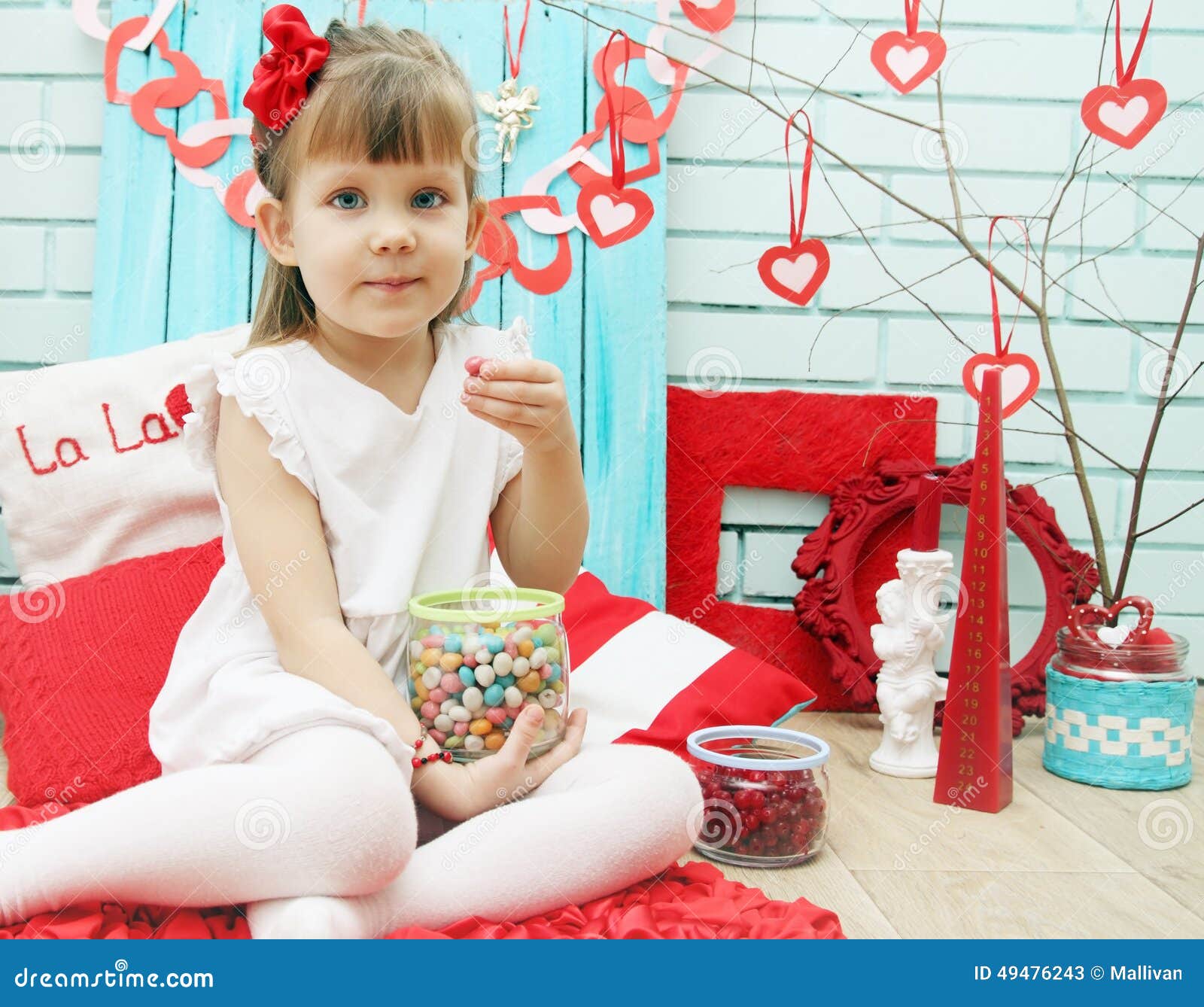 Girl eating candy stock image. Image of brick, holding - 49476243