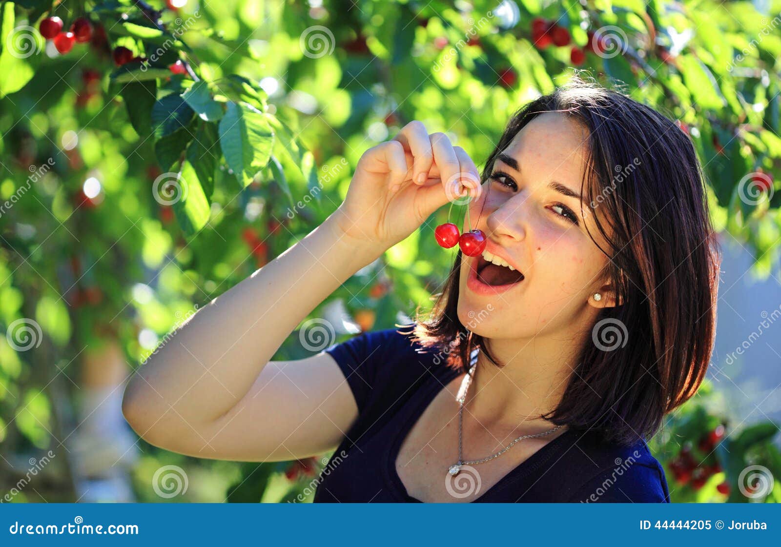 Girl eating cherry stock image. Image of bunch, beauty - 44444205