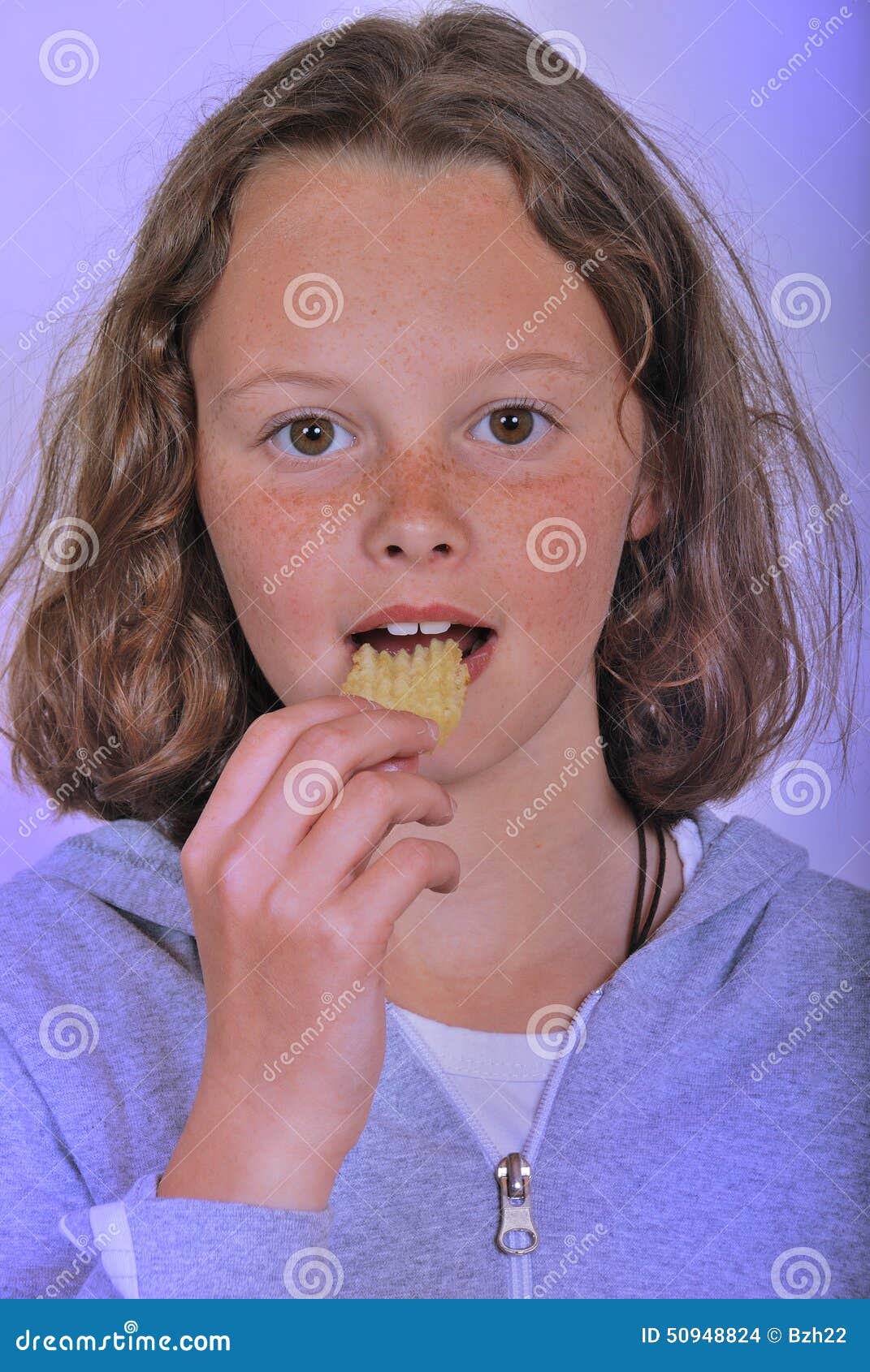 Girl eating chip stock photo. Image of happy, health - 50948824