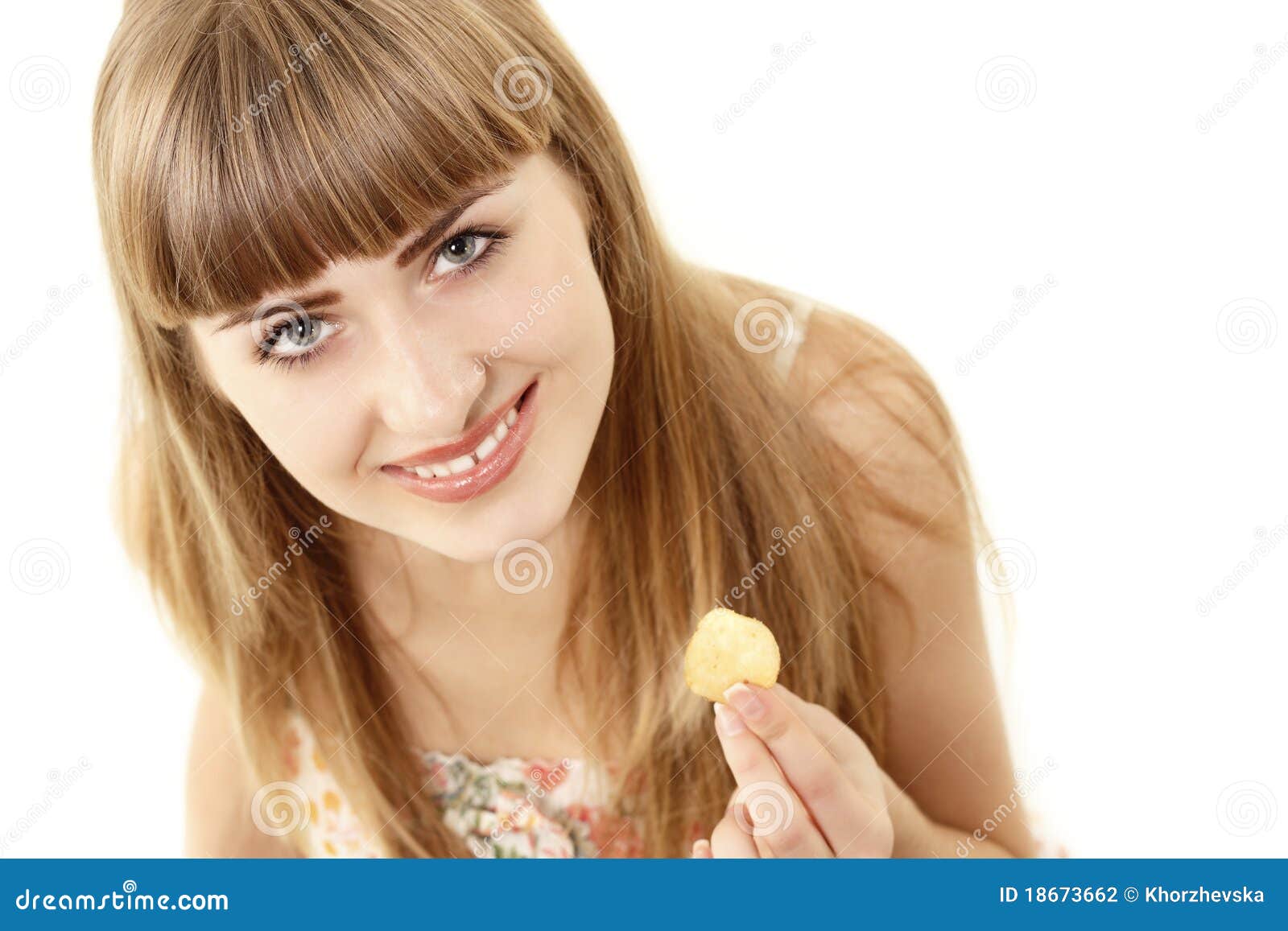 Girl eating chips smiling stock photo. Image of emotion - 18673662