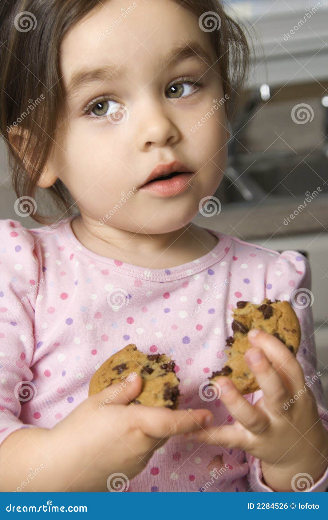 Girl eating cookie. stock photo. Image of food, girl, sweet - 2284526