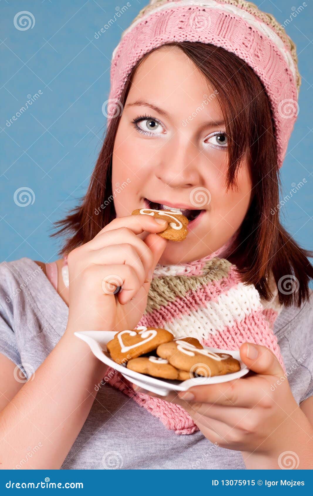 Girl eating cookies stock image. Image of frosting, face - 13075915