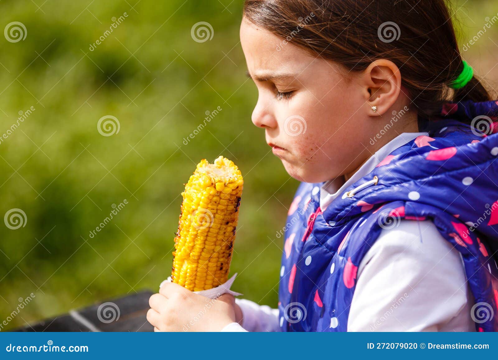 Girl Eating Corn in a Field Stock Photo - Image of summer, cute: 272079020