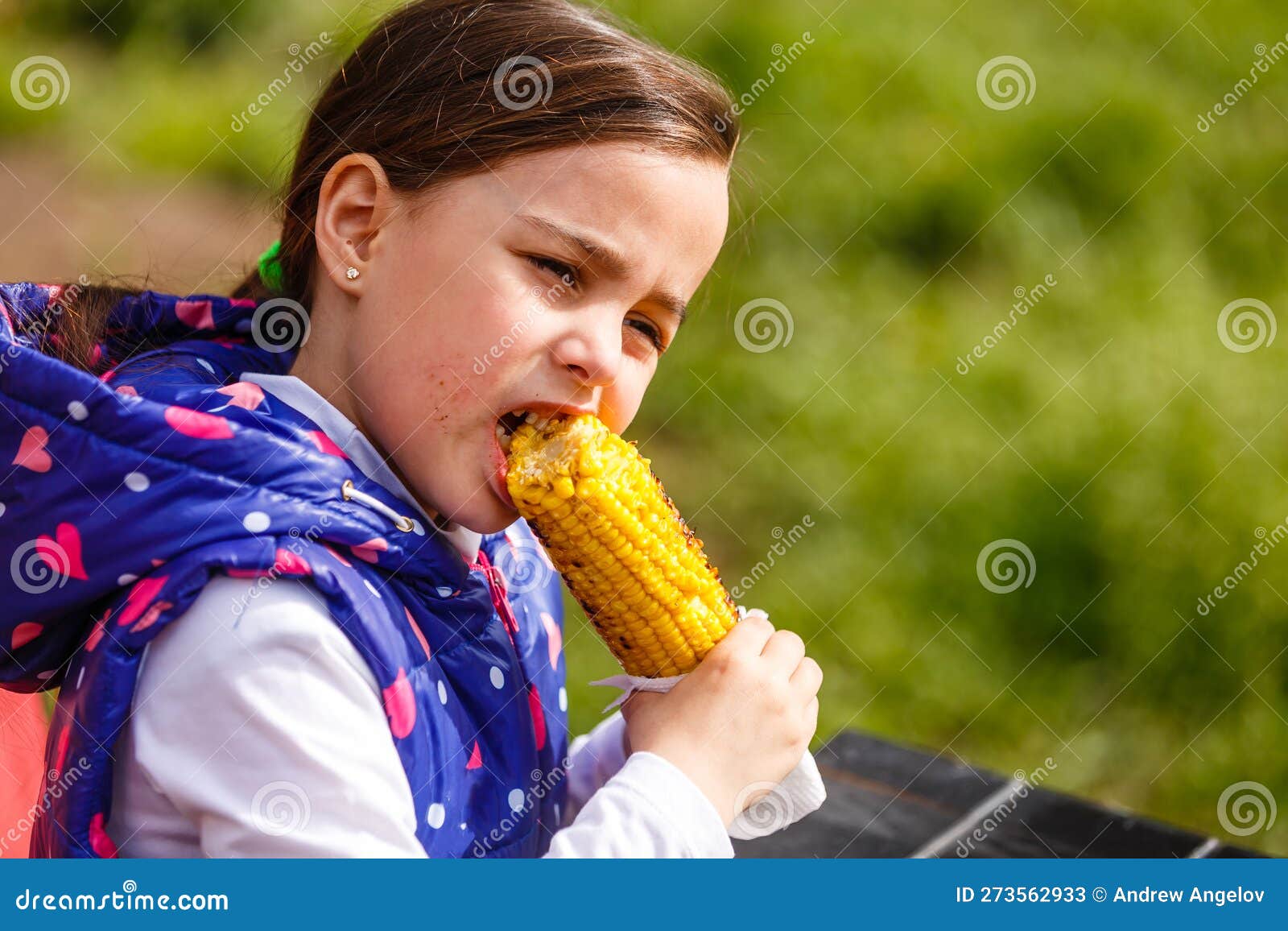 Girl Eating Corn in a Field Stock Image - Image of boiled, activities ...