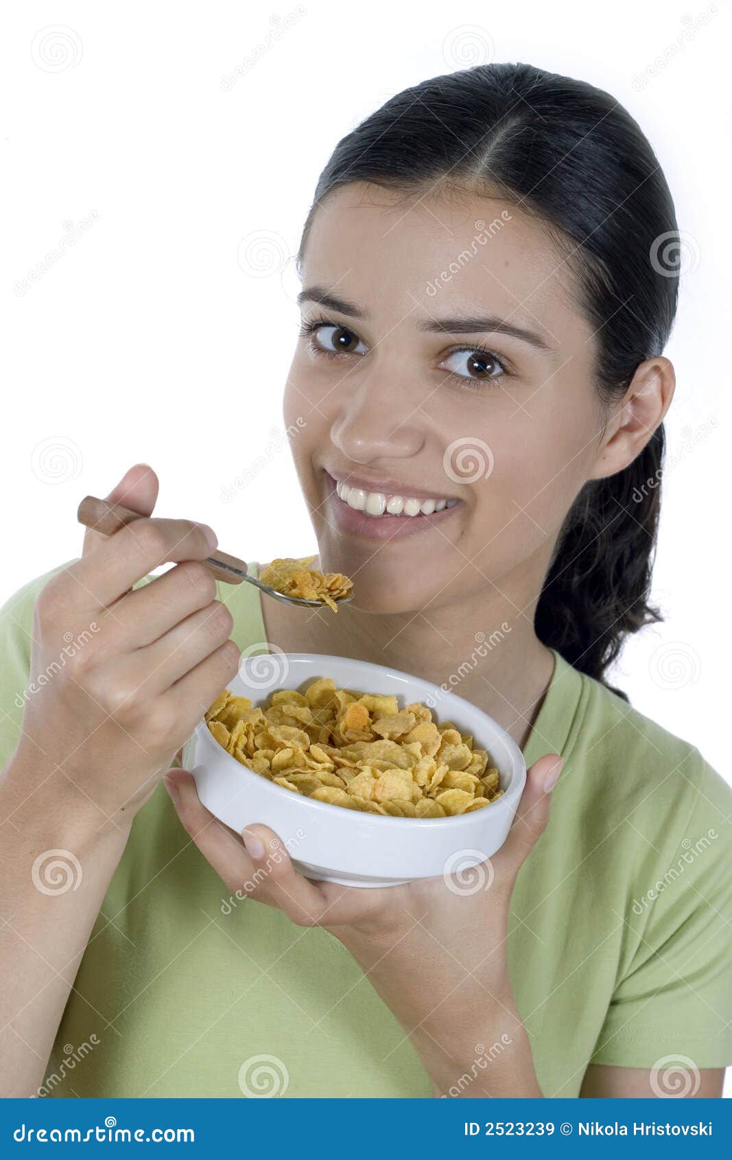 Girl eating cornflakes stock image. Image of female, grain - 2523239