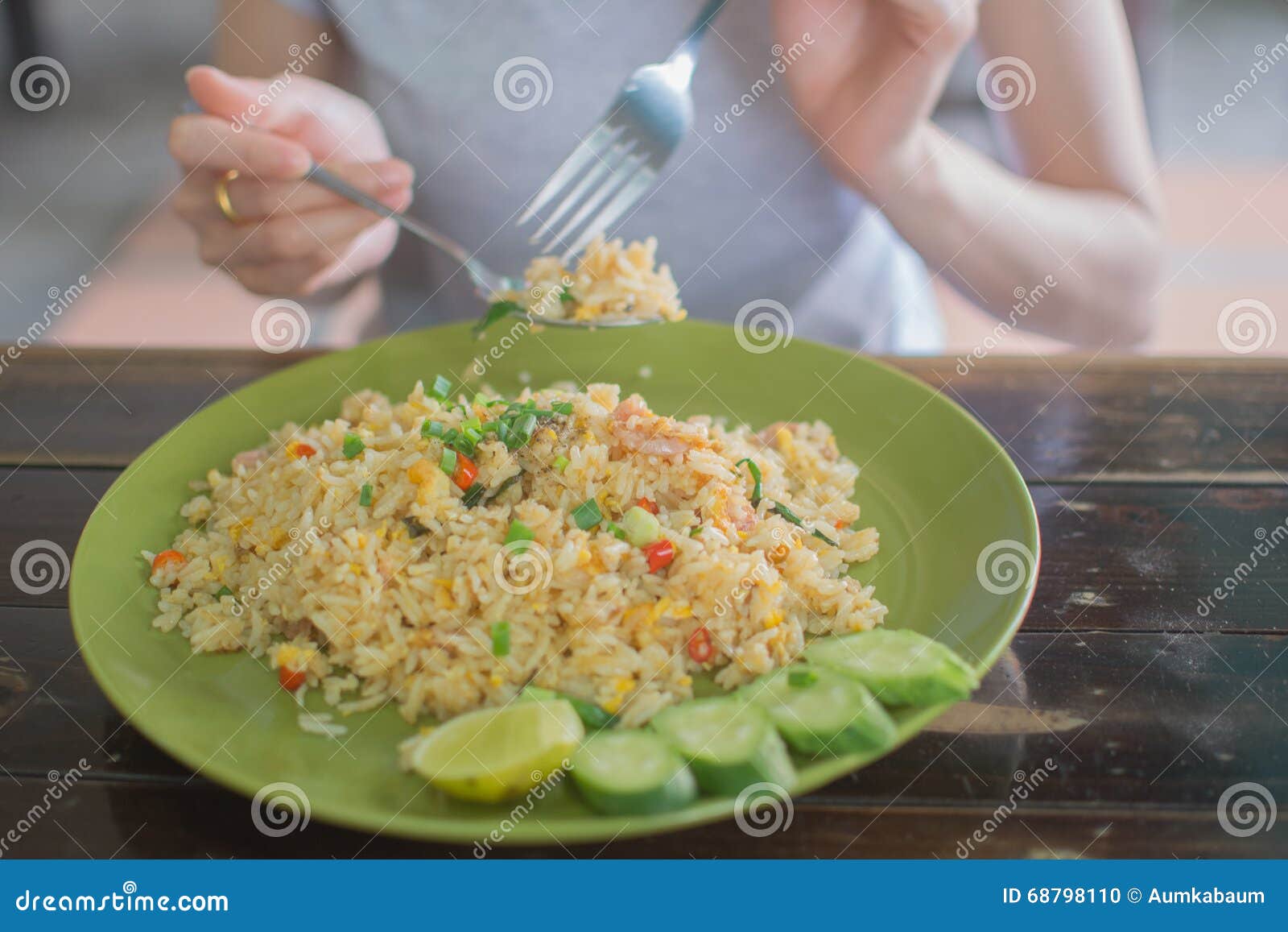 A girl eating Fried rice stock photo. Image of food, onion - 68798110