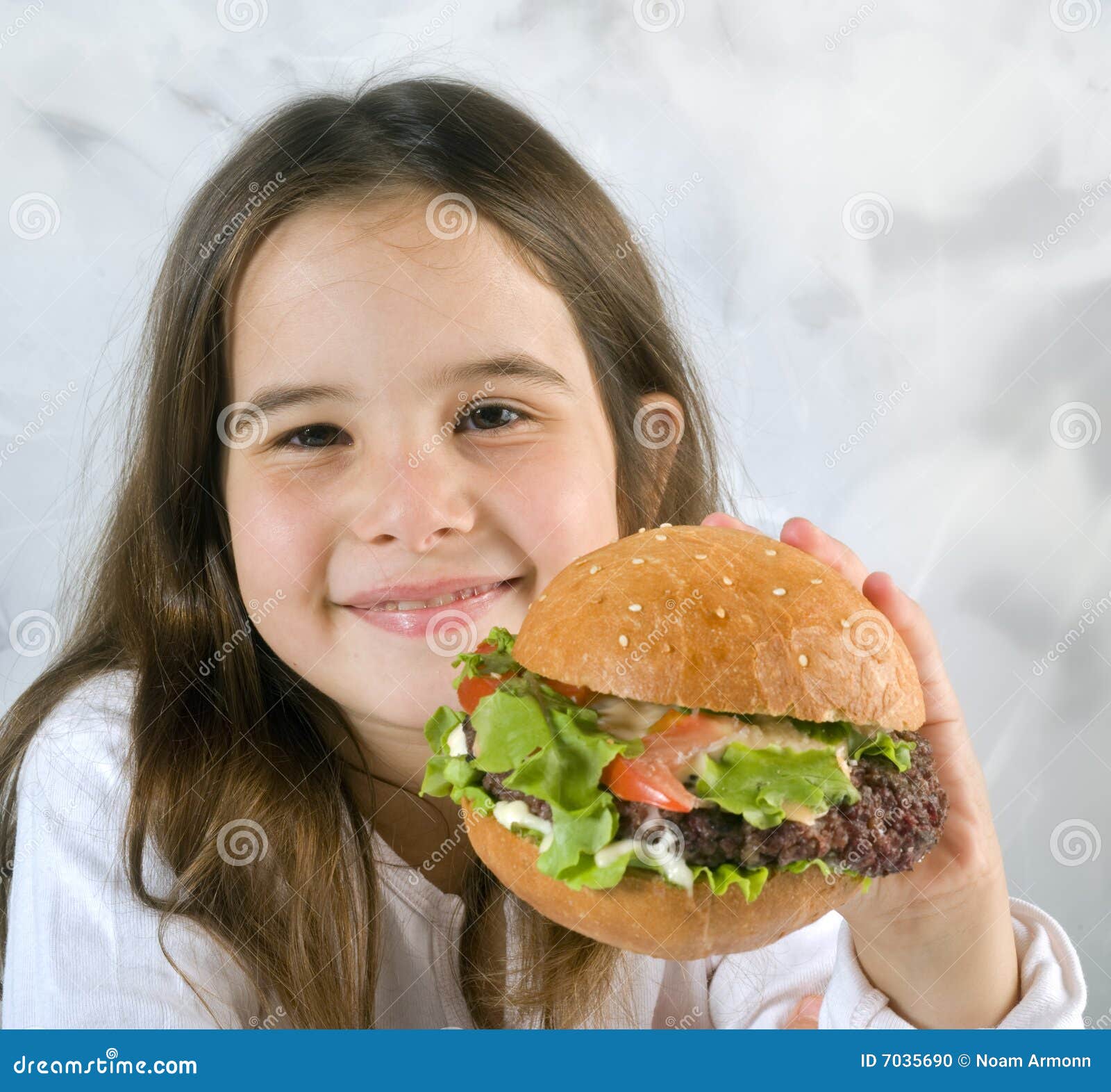Girl eating hamburger stock photo. Image of anticipation - 7035690