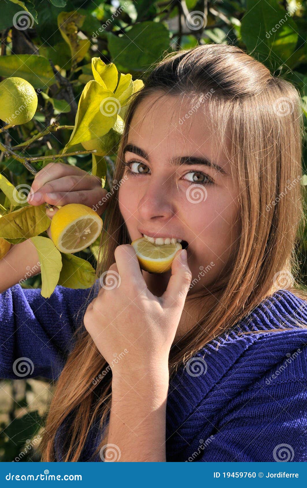 Girl eating a lemon stock photo. Image of europe, fresh - 19459760