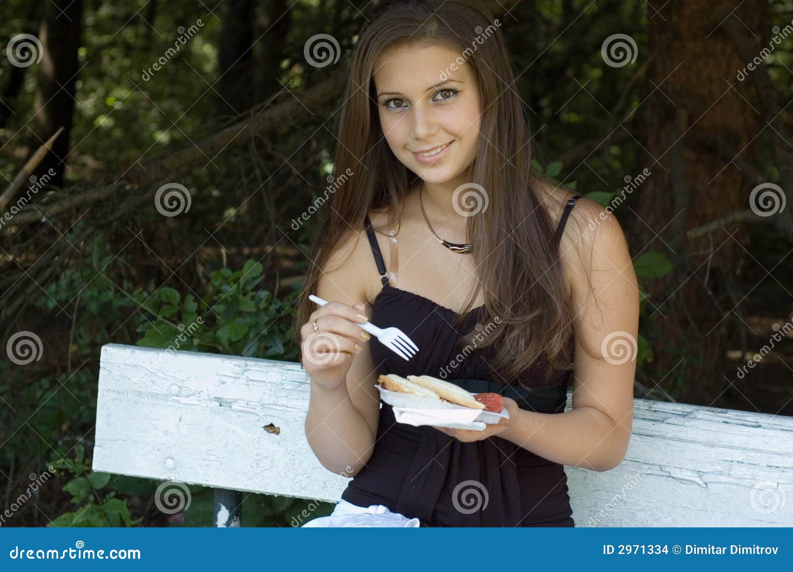 Girl eating lunch outdoors stock photo. Image of eating - 2971334