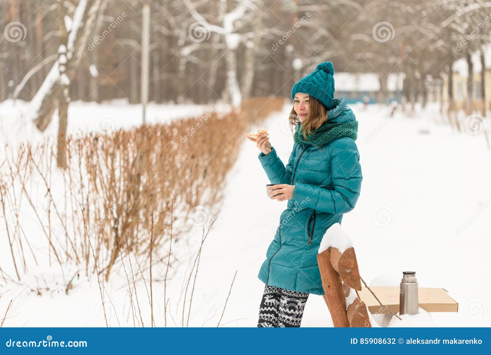 Girl Eating Pizza in the Cold Winter Stock Photo - Image of face ...