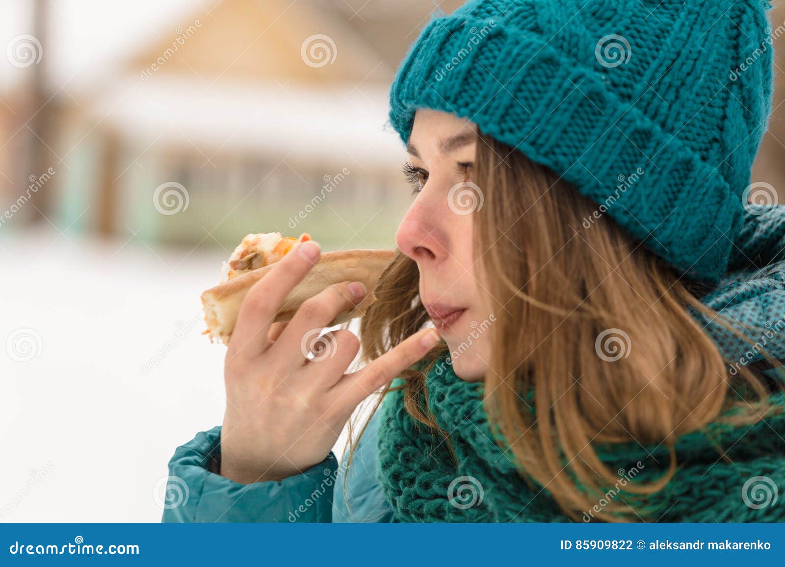 Girl Eating Pizza in the Cold Winter Stock Photo - Image of eating ...