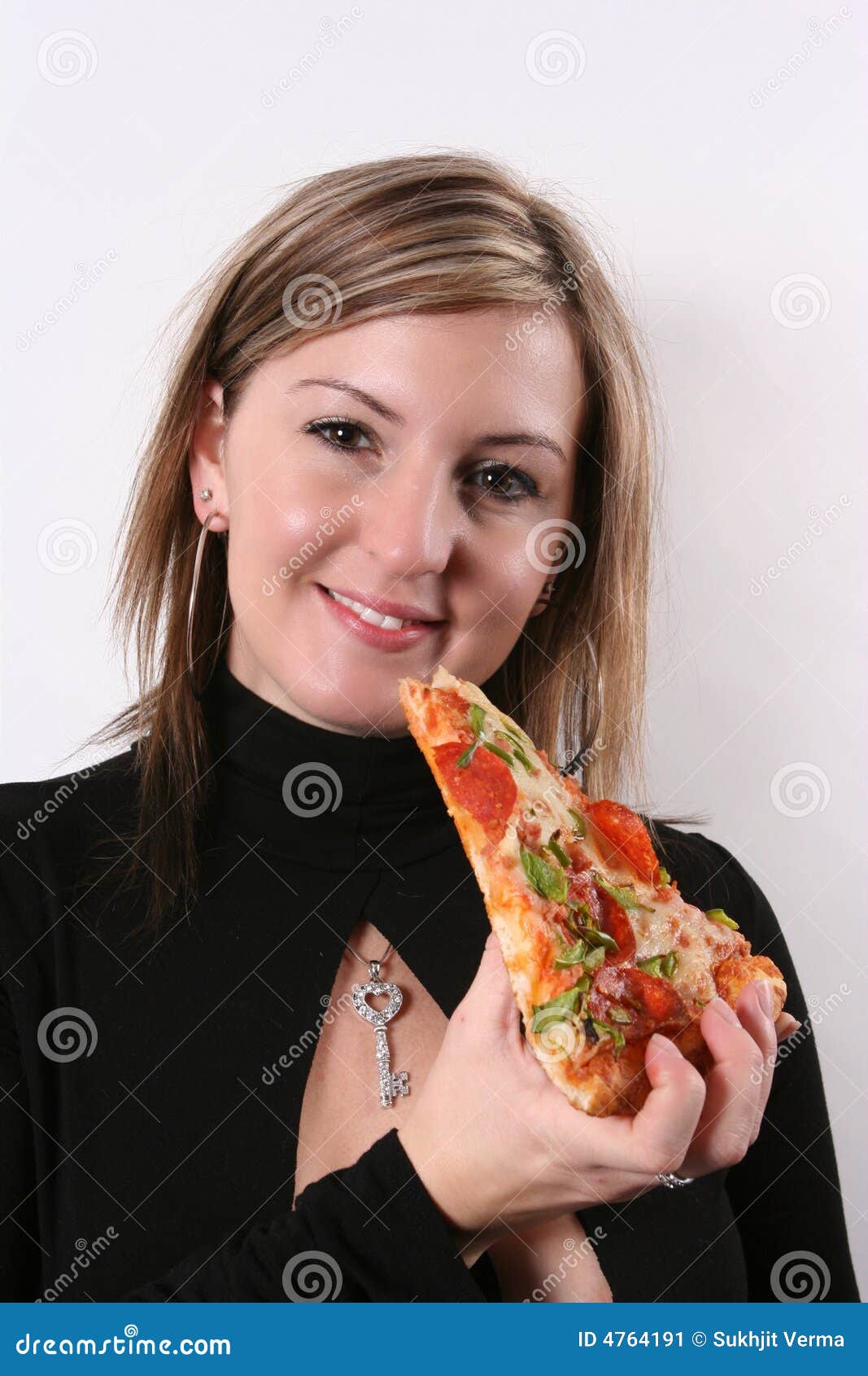 Girl eating pizza slice stock image. Image of onion, green - 4764191