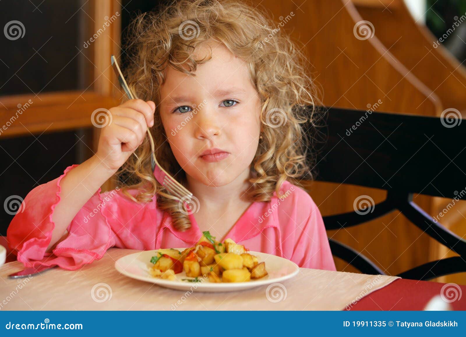 Girl eating potatoes stock image. Image of dinner, girl - 19911335