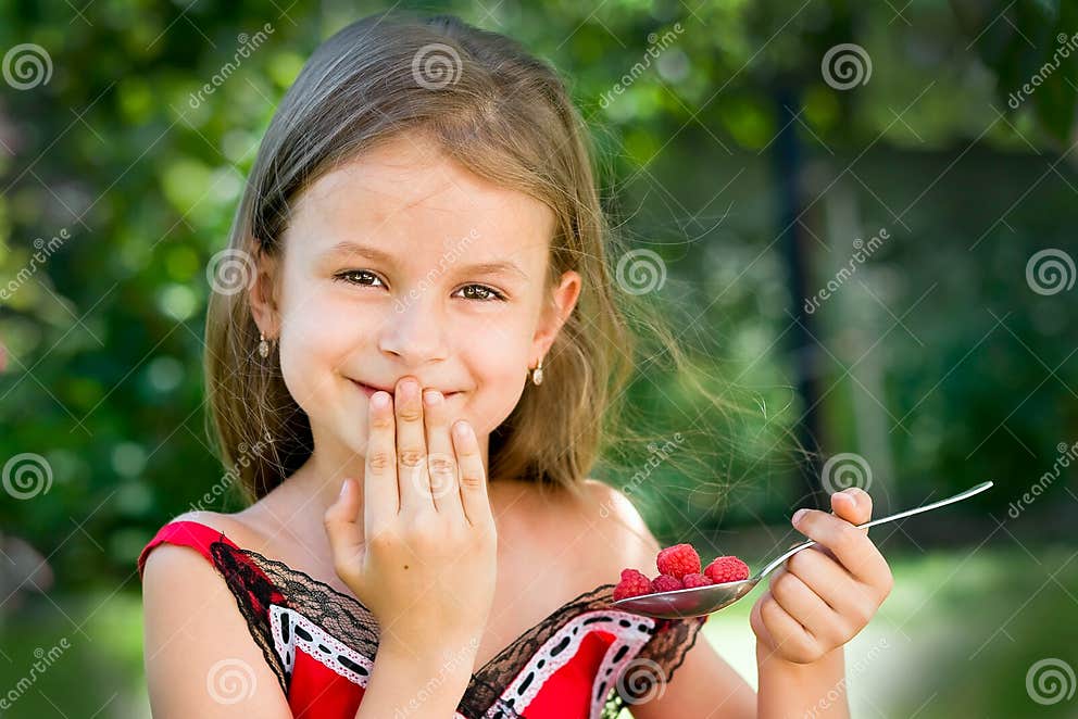 Girl eating raspberry stock image. Image of beauty, spoon - 10013217