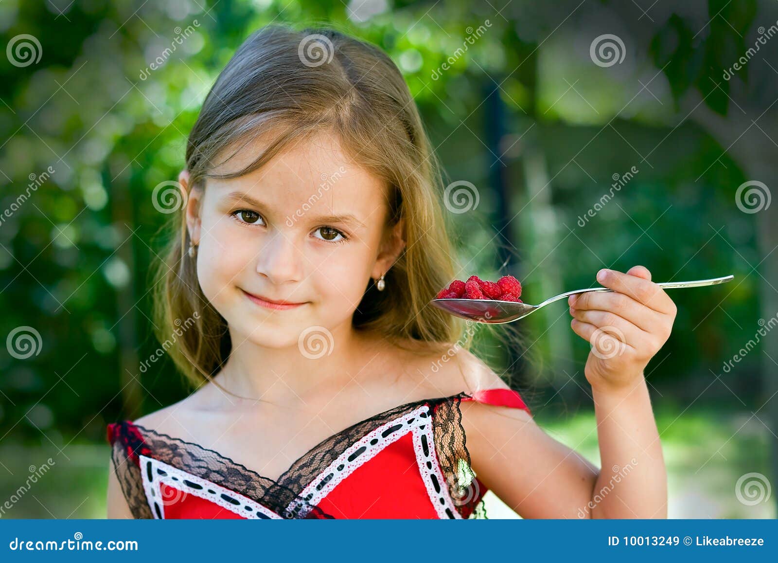 Girl eating raspberry stock image. Image of healthy, beauty - 10013249