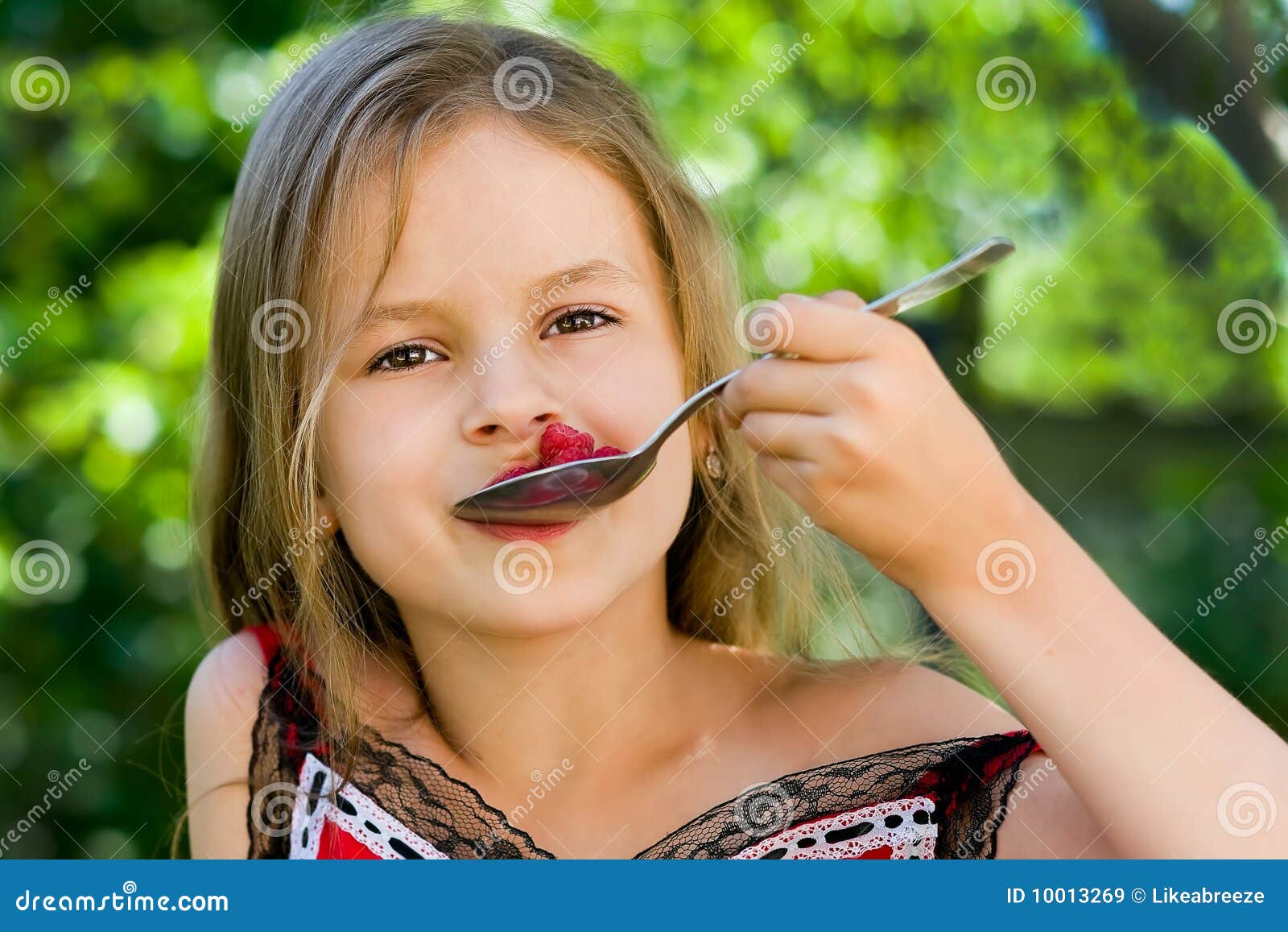 Girl eating raspberry stock image. Image of beauty, girl - 10013269
