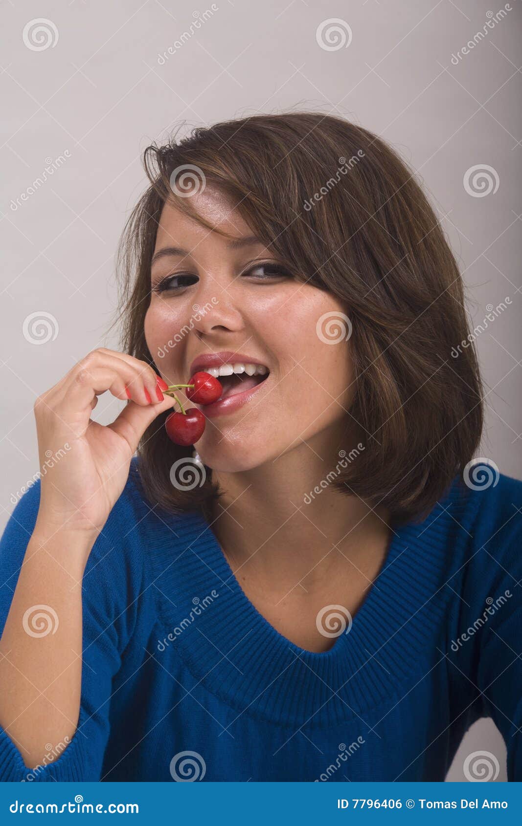 Girl eating red cherries stock photo. Image of diet, face - 7796406