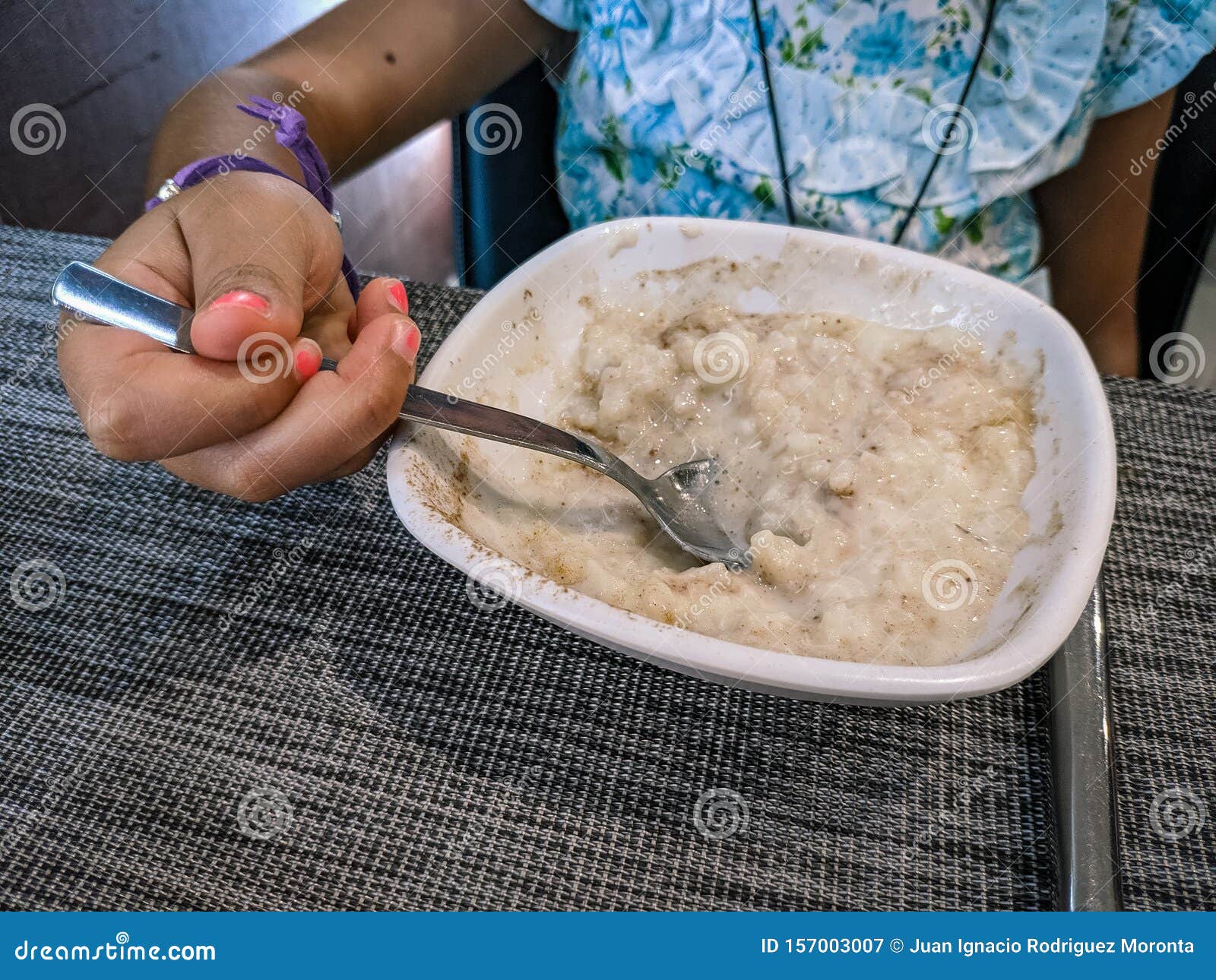 Girl Eating Rice Pudding with Pink Fingernails Stock Image - Image of ...
