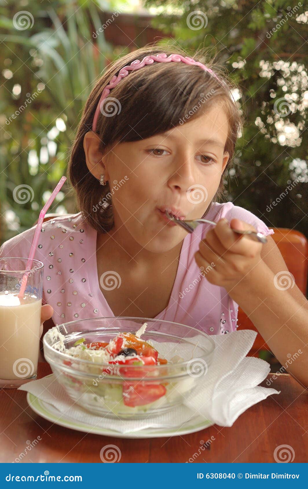 Girl eating salad stock photo. Image of table, nutritious - 6308040