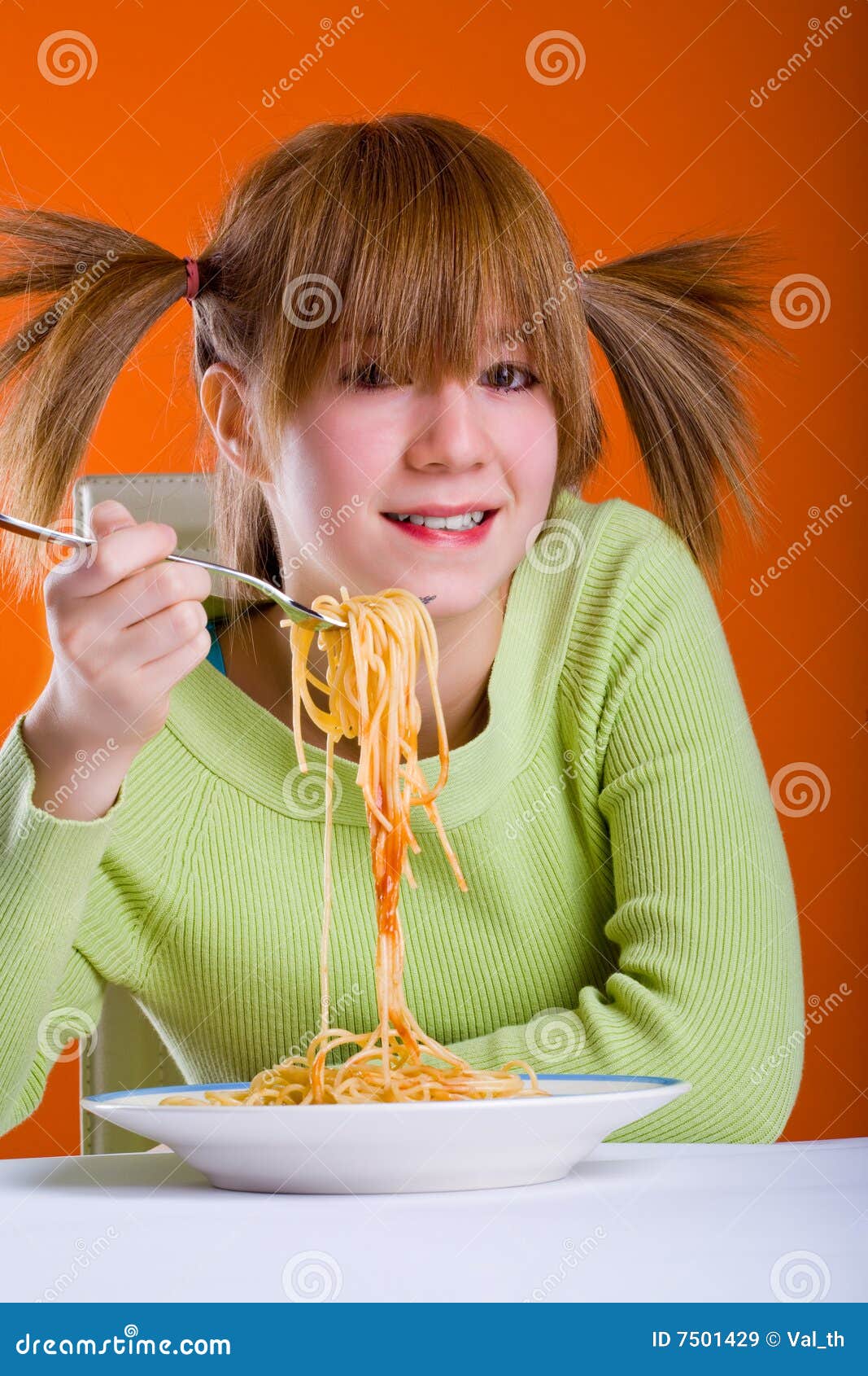 Girl eating spaghetti stock image. Image of face, teen - 7501429