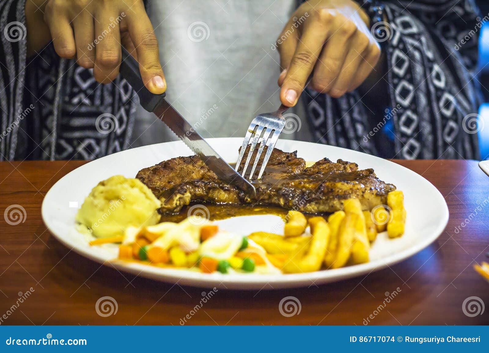 Girl eating a steak. stock photo. Image of dish, female - 86717074