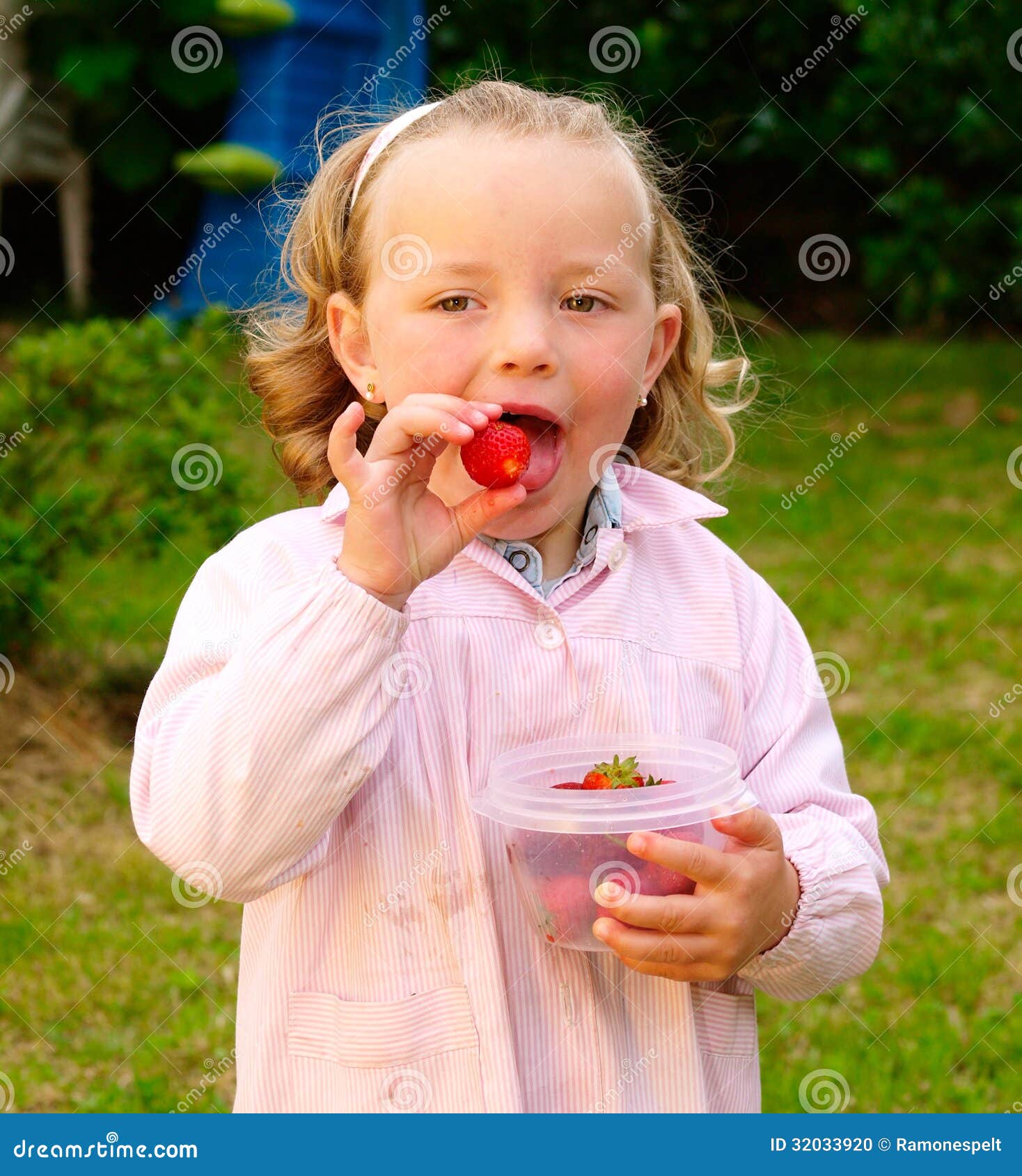 Girl Eating Strawberries Outdoors Stock Photo - Image of habit, idea ...