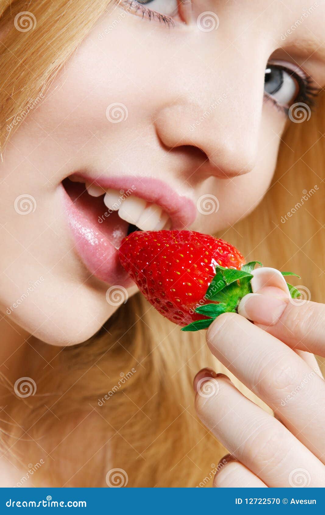 Girl eating strawberry stock photo. Image of glamour - 12722570