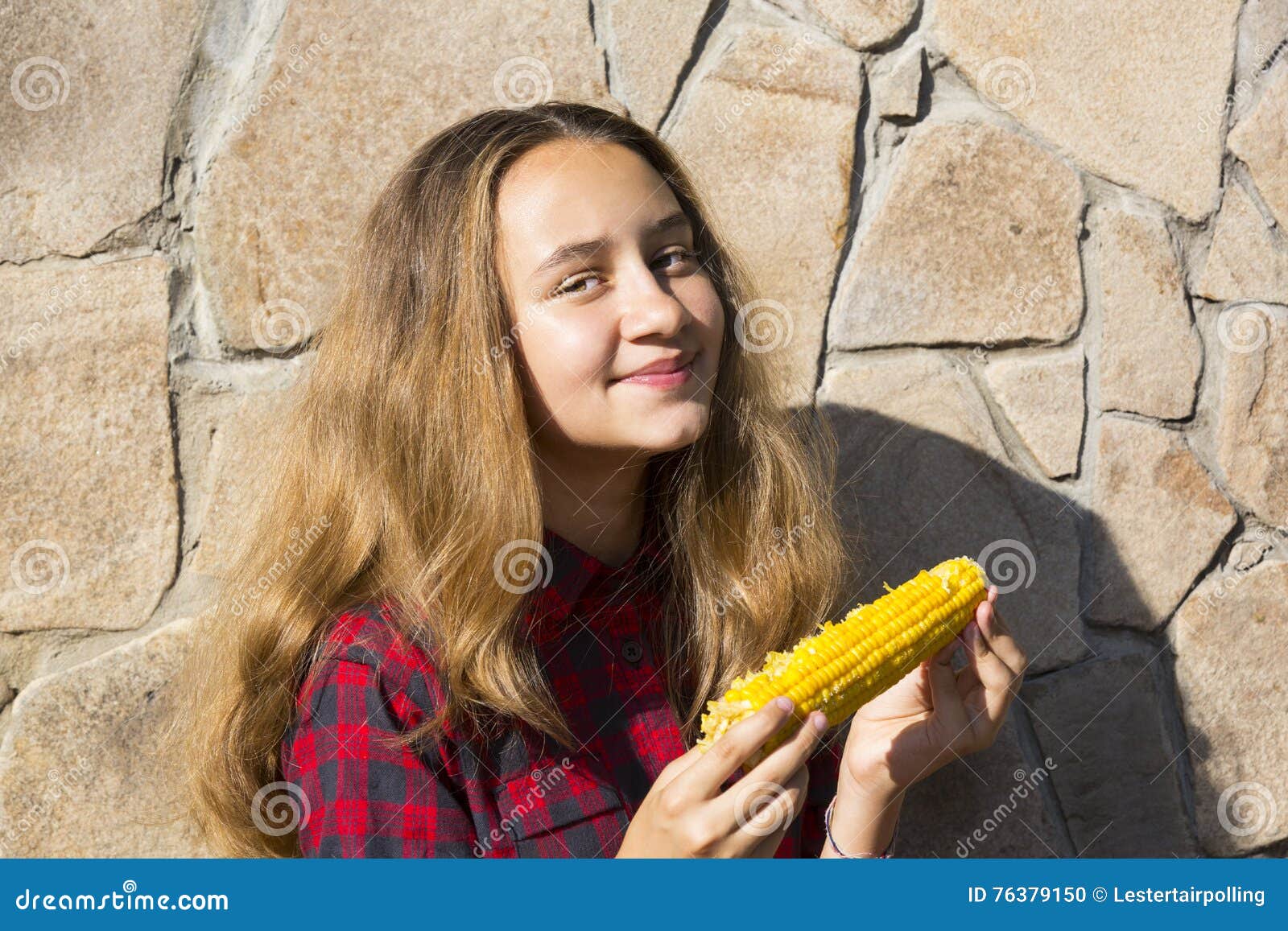 Girl eating sweet corn stock photo. Image of child, nutritious - 76379150