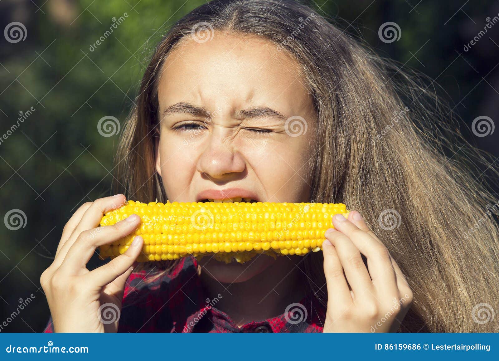 Girl eating sweet corn stock photo. Image of bite, seed - 86159686