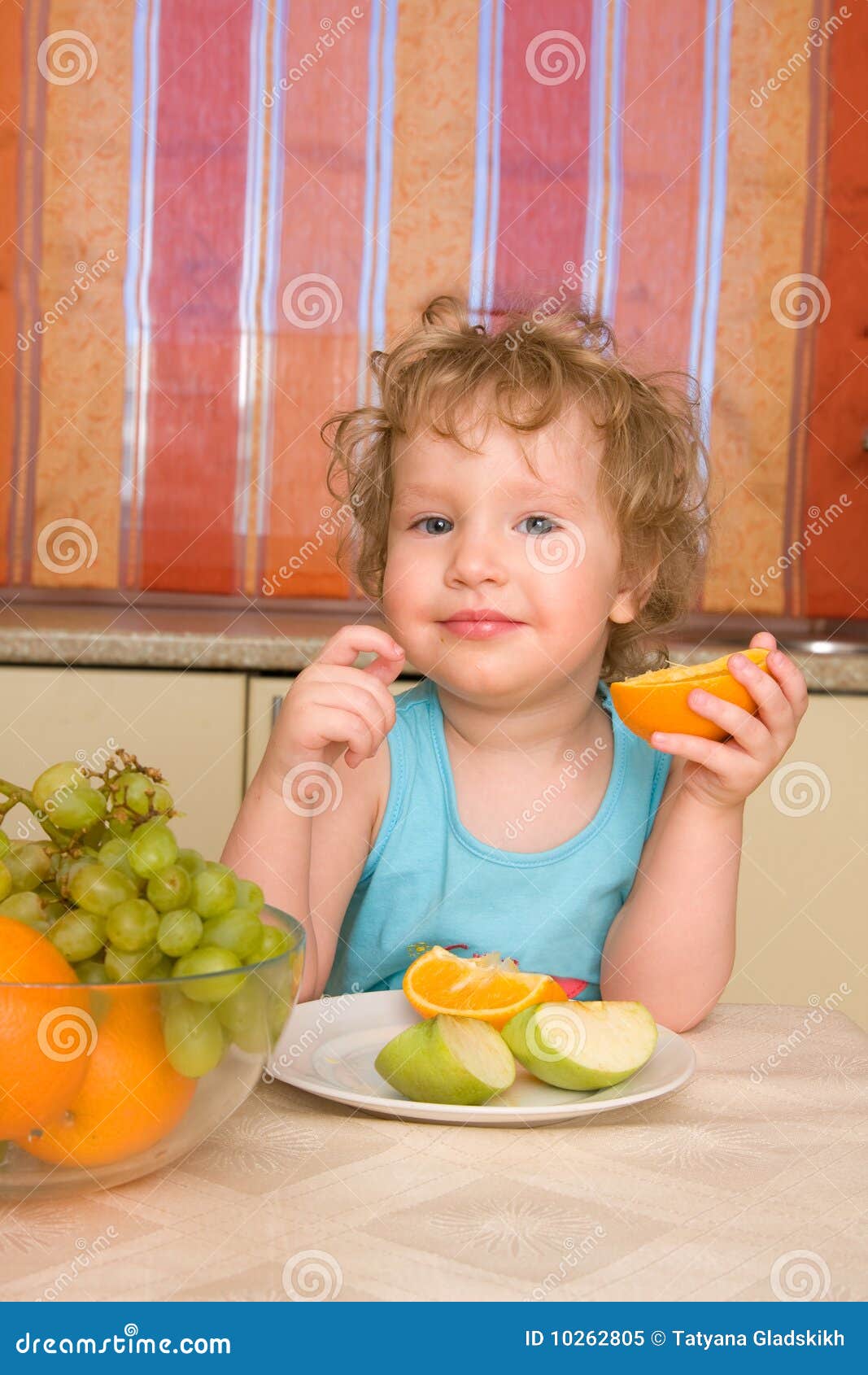 Girl eats fruit stock image. Image of color, people, looking - 10262805