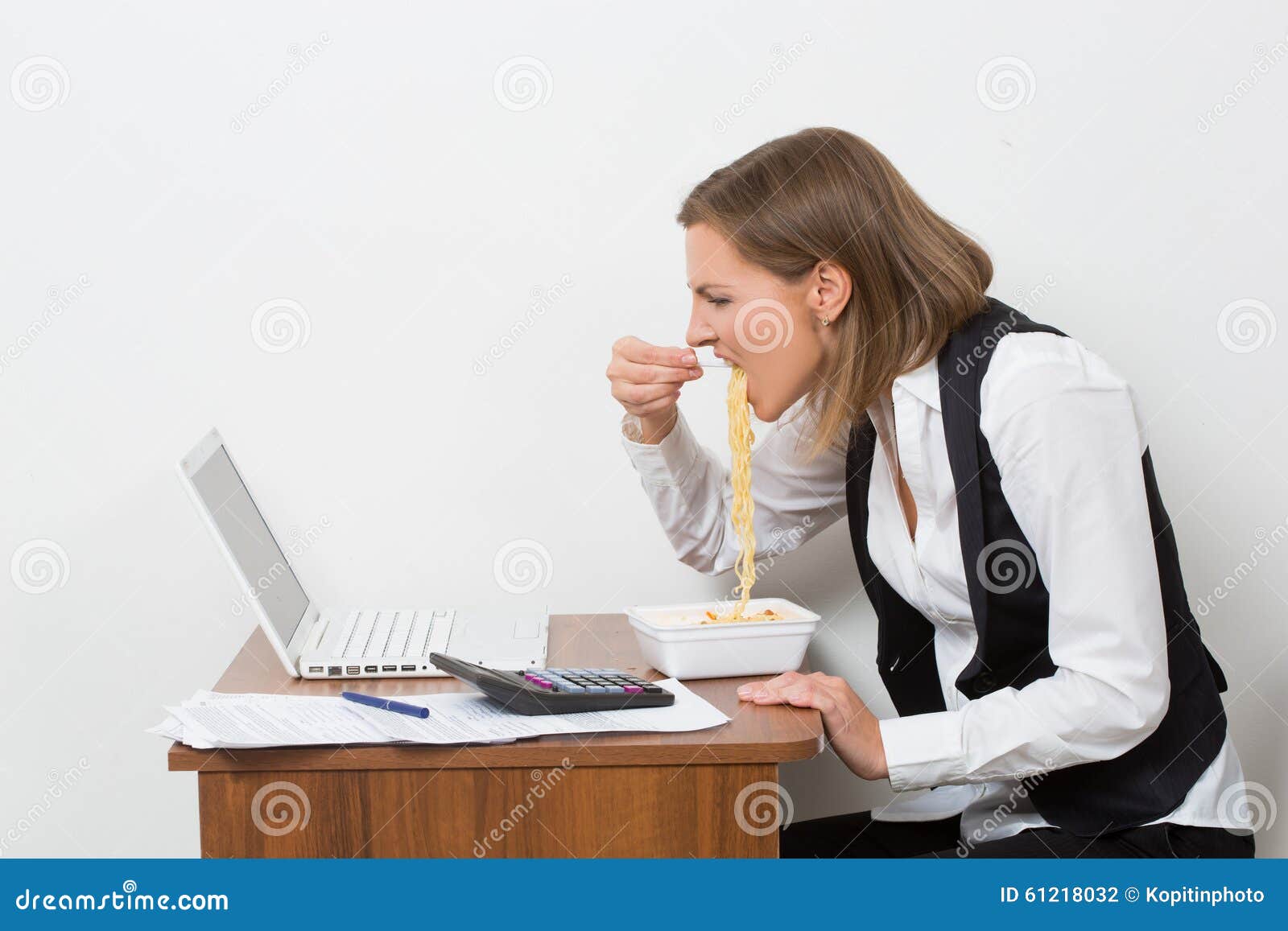 Girl Eats a Pasta, Working Behind the Laptop Stock Photo - Image of ...