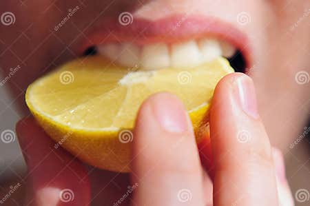 Girl Eats Sour Lemon stock image. Image of eating, fruits - 16966693
