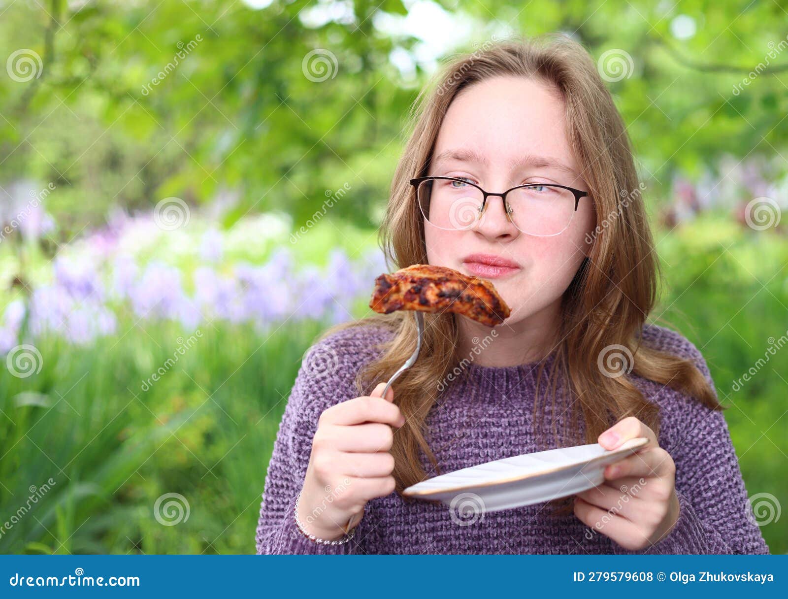 The Girl Eats a Steak in Nature. Picnic Stock Photo - Image of girls ...