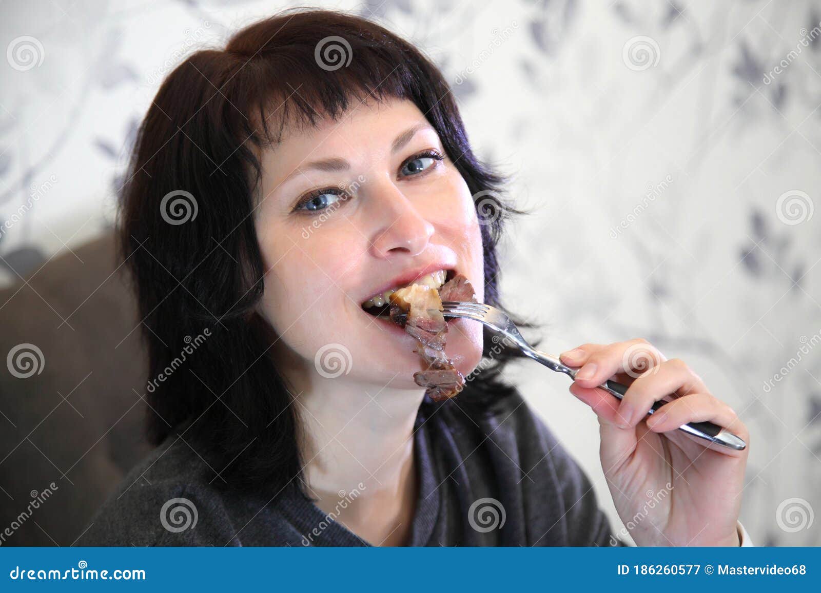 Girl Eats Steak with Wine. Girl Passionately Eats Steak Stock Image ...
