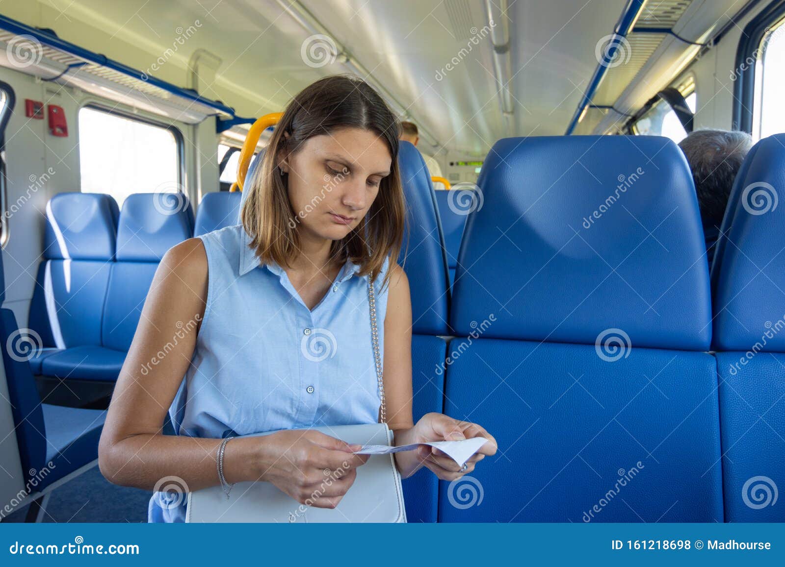 A Girl in an Electric Train Looks at a Ticket Stock Photo - Image of ...