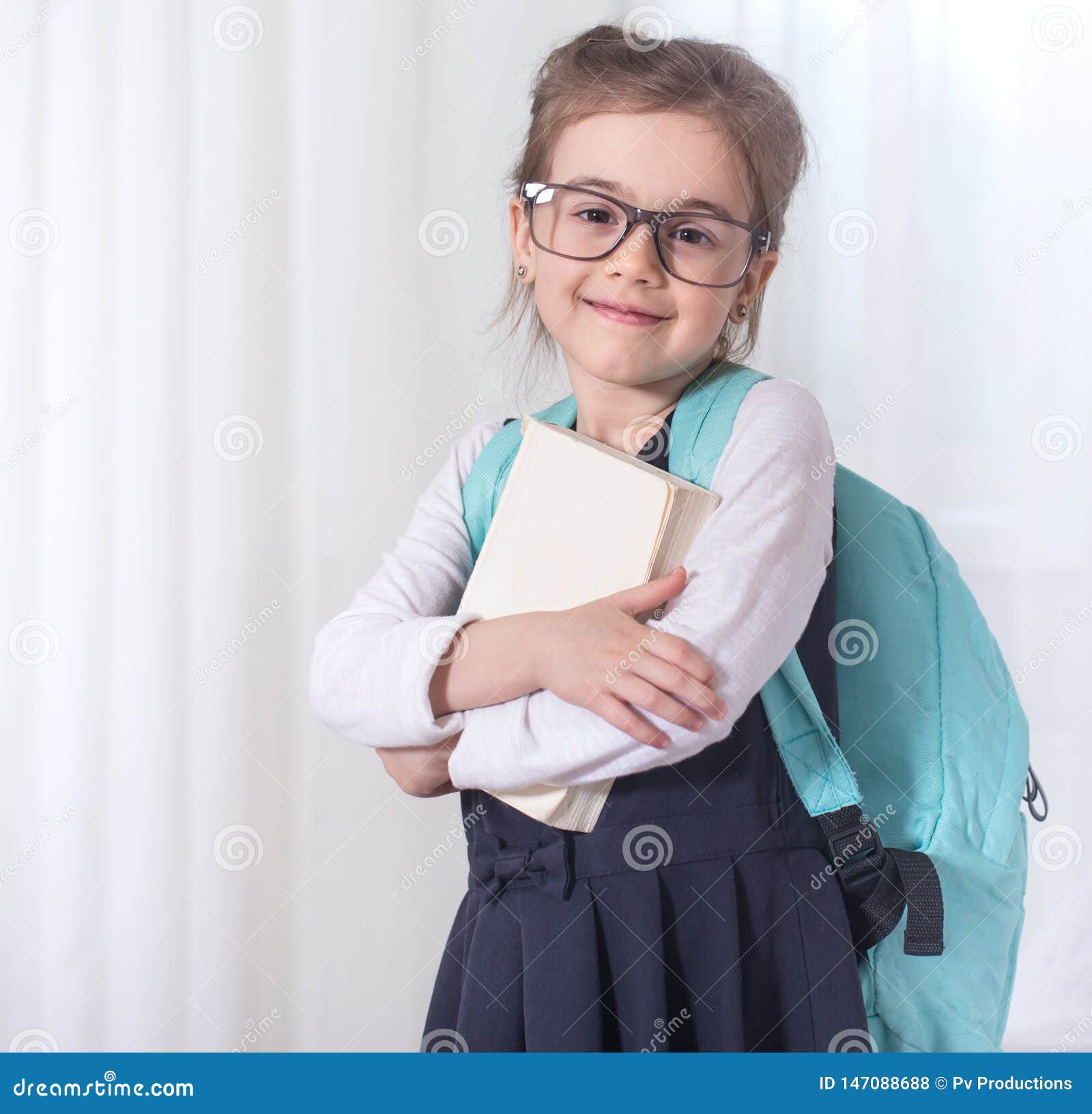 Girl-elementary School Student with a Backpack and a Book Stock Photo ...