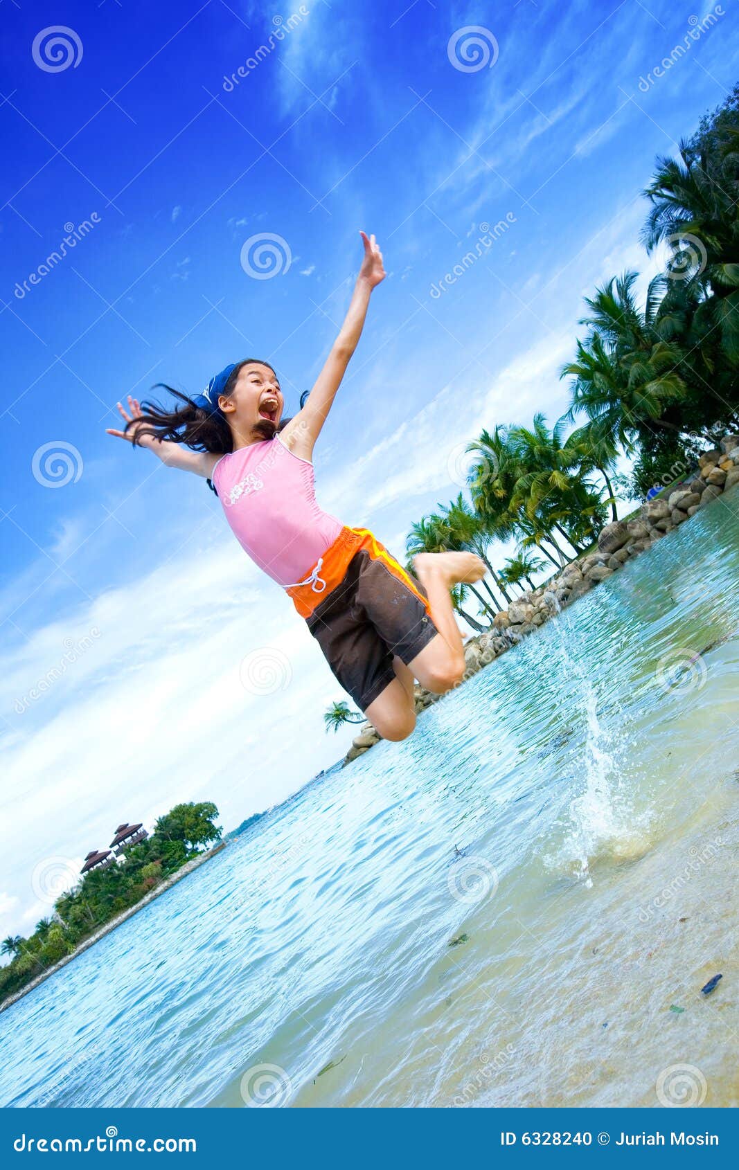 Girl Excited, Jumping on the Lagoon Beach Stock Photo - Image of ...