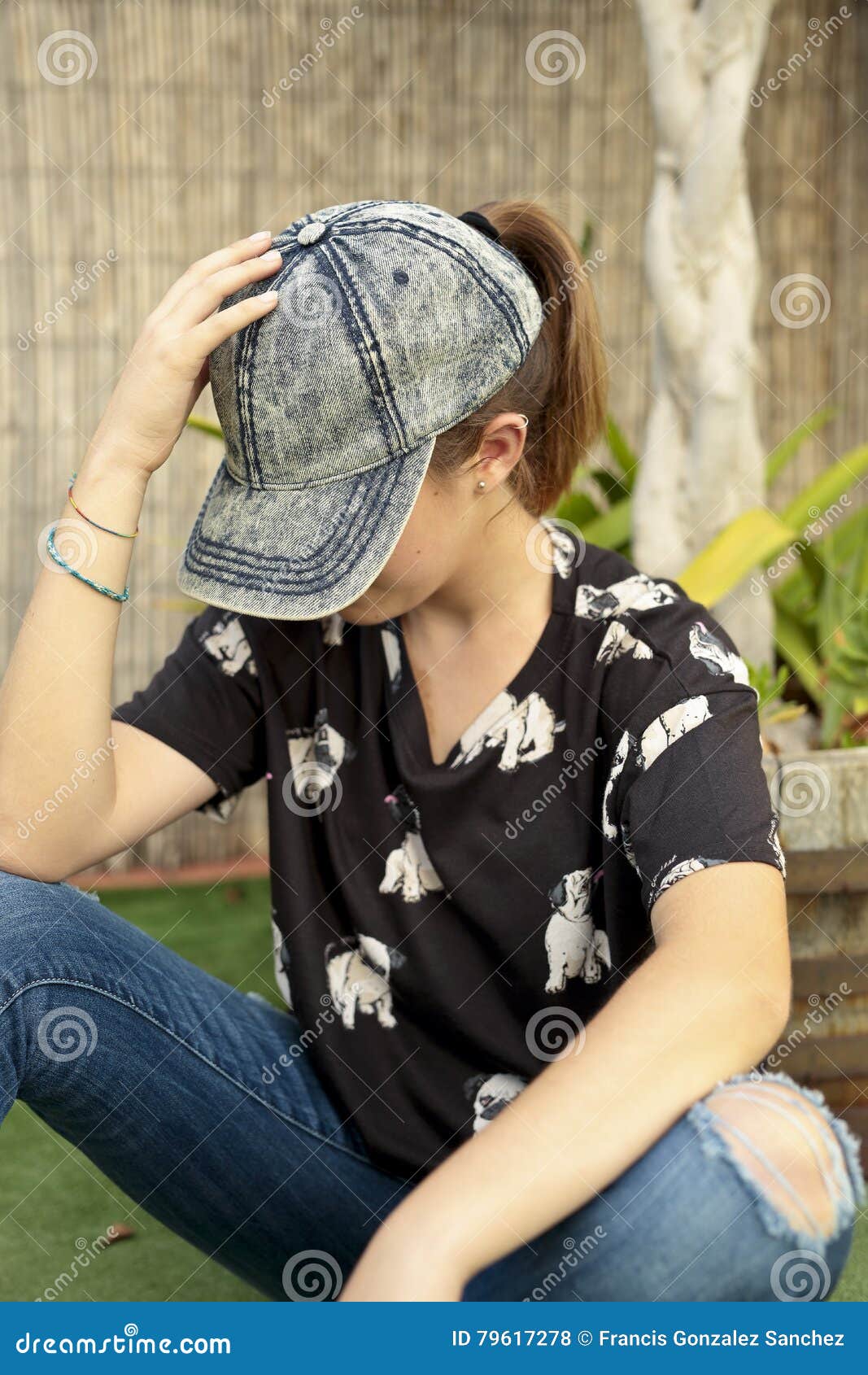 Girl with Face Covered with His Cap. Stock Photo - Image of portrait ...