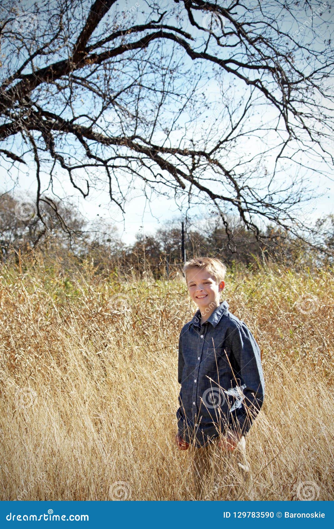 Girl in Fall Grass field stock photo. Image of smiling - 129783590