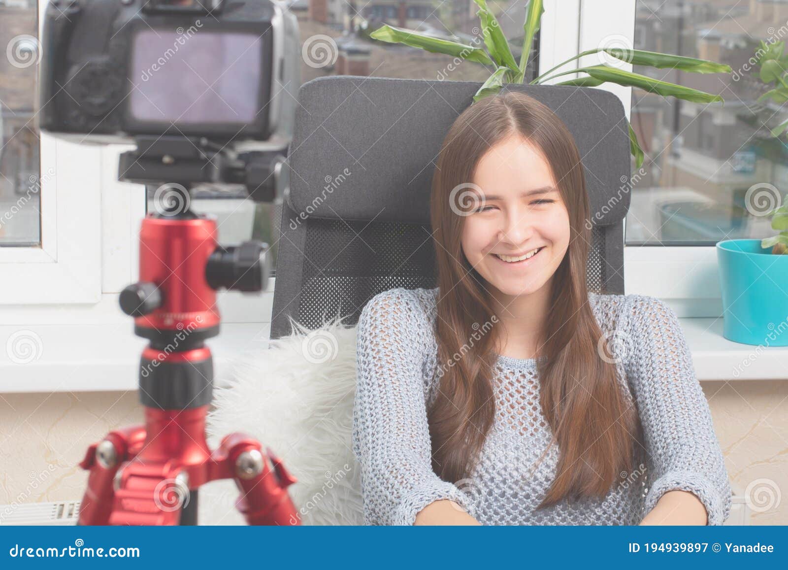 Girl Filming Herself at Home in Front of the Camera, Smiling Stock ...