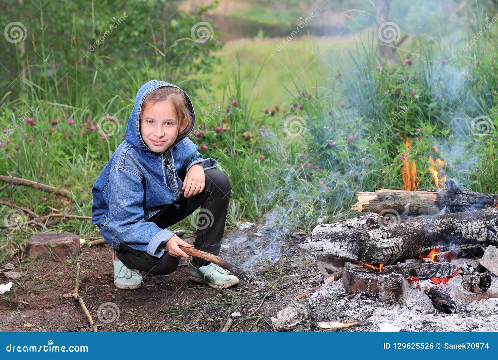 Girl by the fire stock photo. Image of girl, smoke, park - 129625526