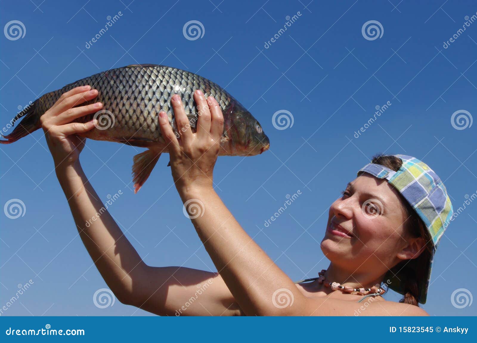 The girl with fish stock image. Image of destinations - 15823545
