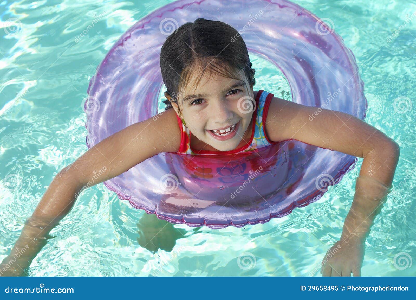 Girl Floating on Inflatable Raft in Swimming Pool Stock Image - Image ...