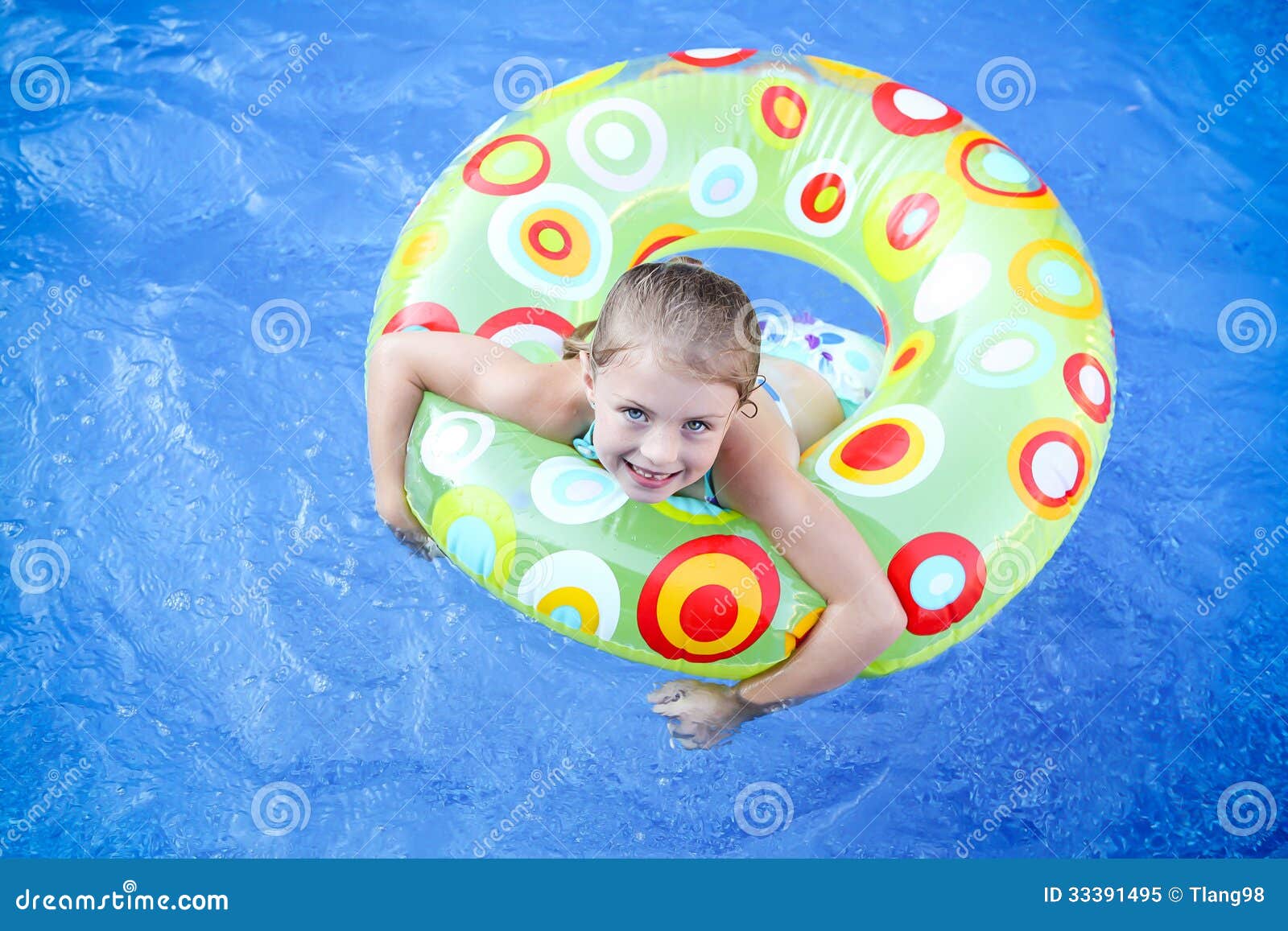 Girl Floating On Inflatable Raft In Swimming Pool Royalty-Free Stock ...
