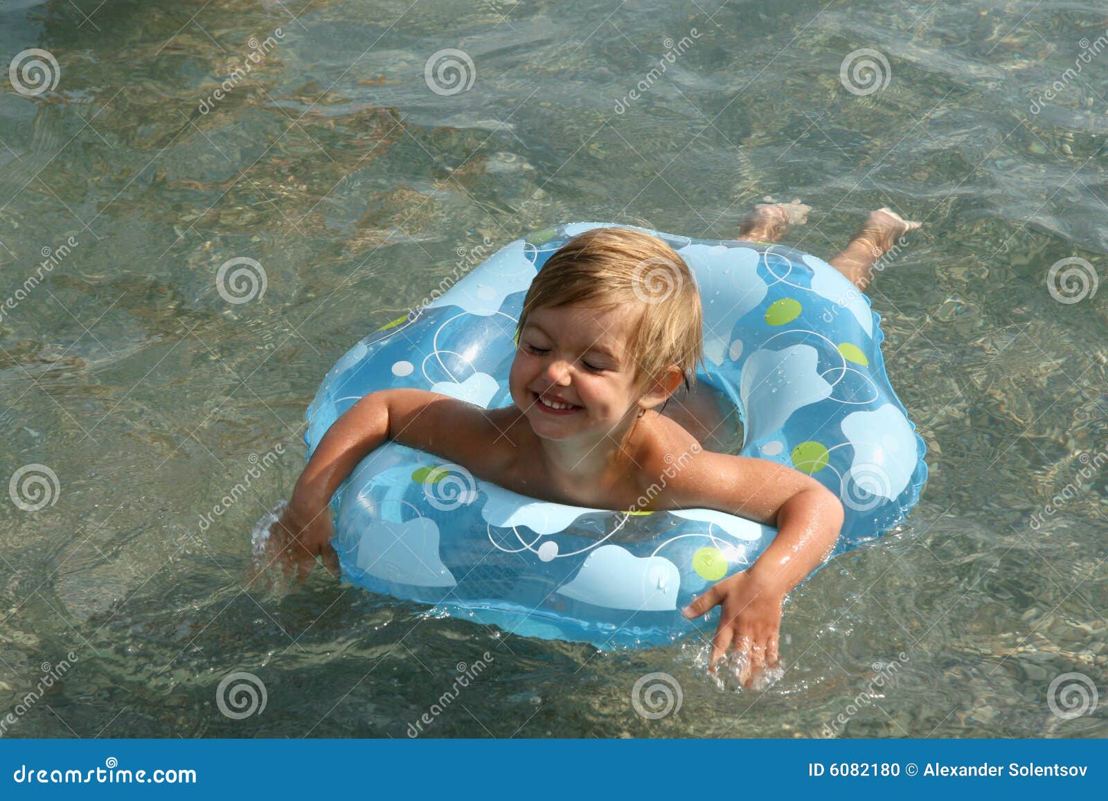 Girl Floats on a Lifebuoy Ring Stock Photo - Image of nature, safety ...