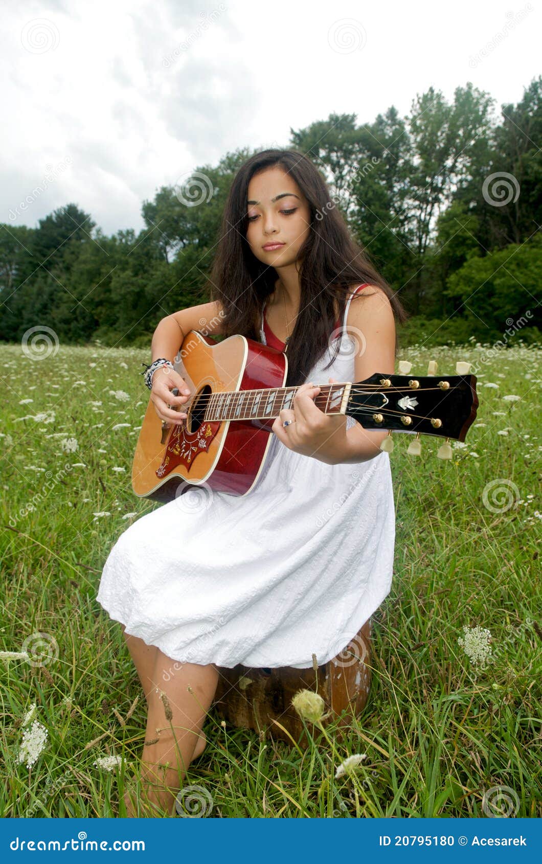 Girl in Flower Field Playing a Guitar Stock Photo - Image of lovely ...