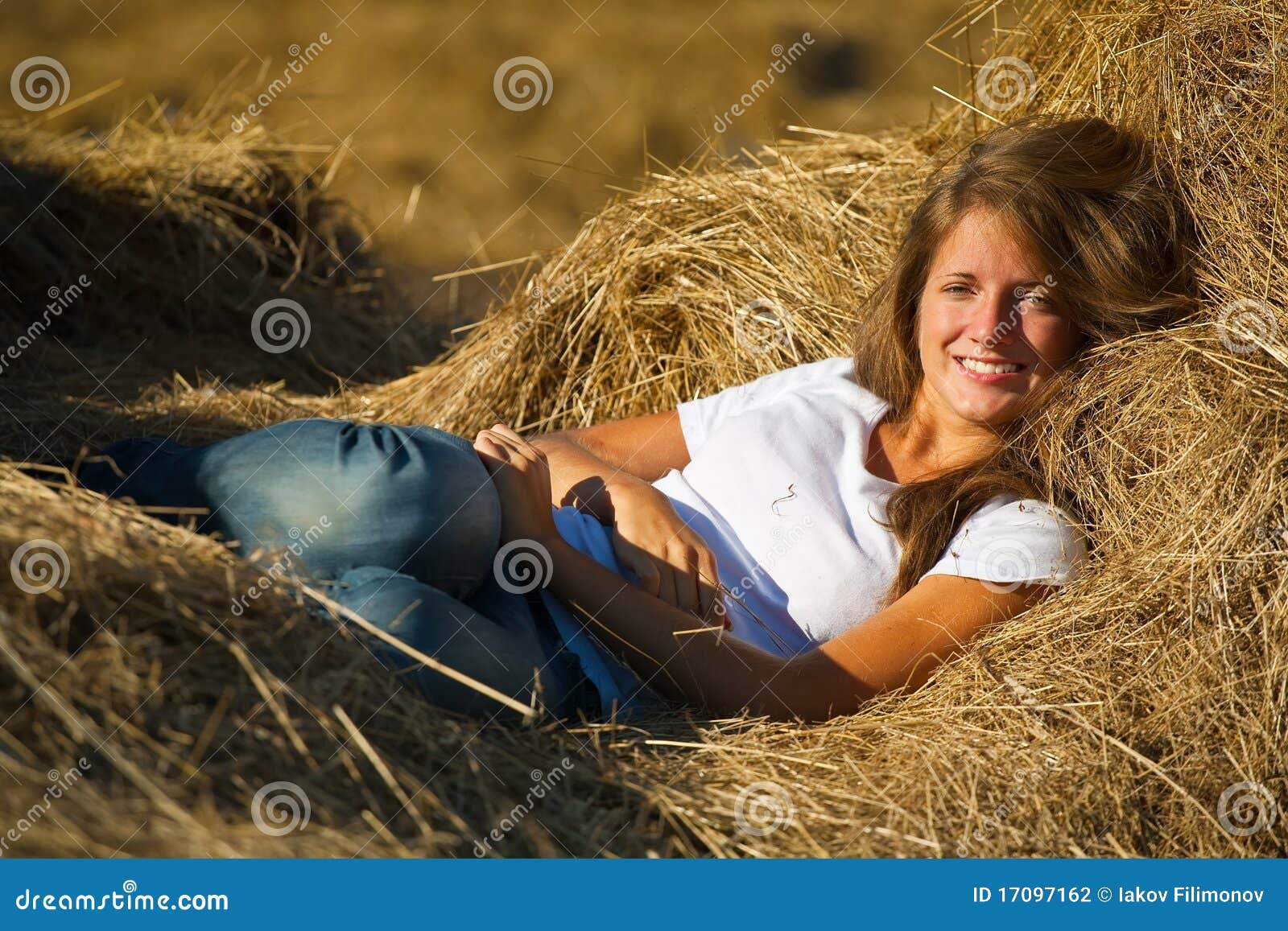 Girl on fresh hay stock photo. Image of sunning, resting - 17097162